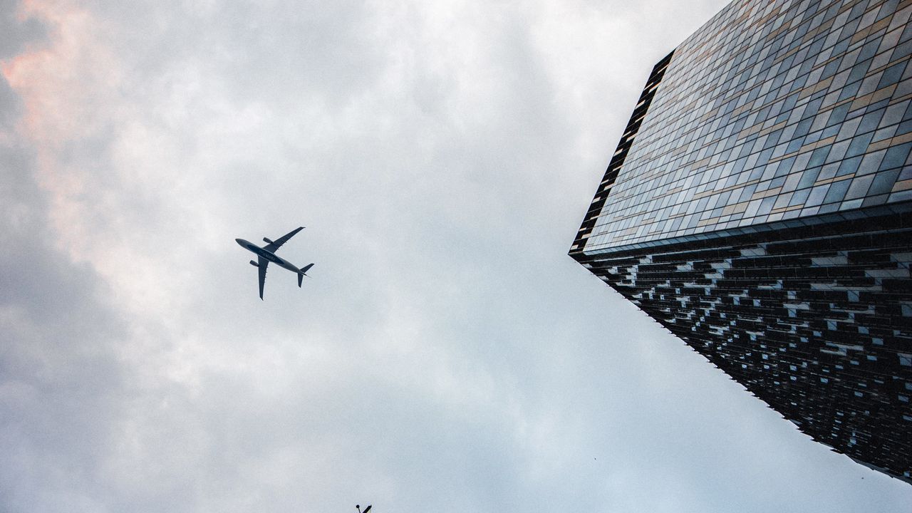 Wallpaper airplane, buildings, flight, bottom view, sky hd, picture, image