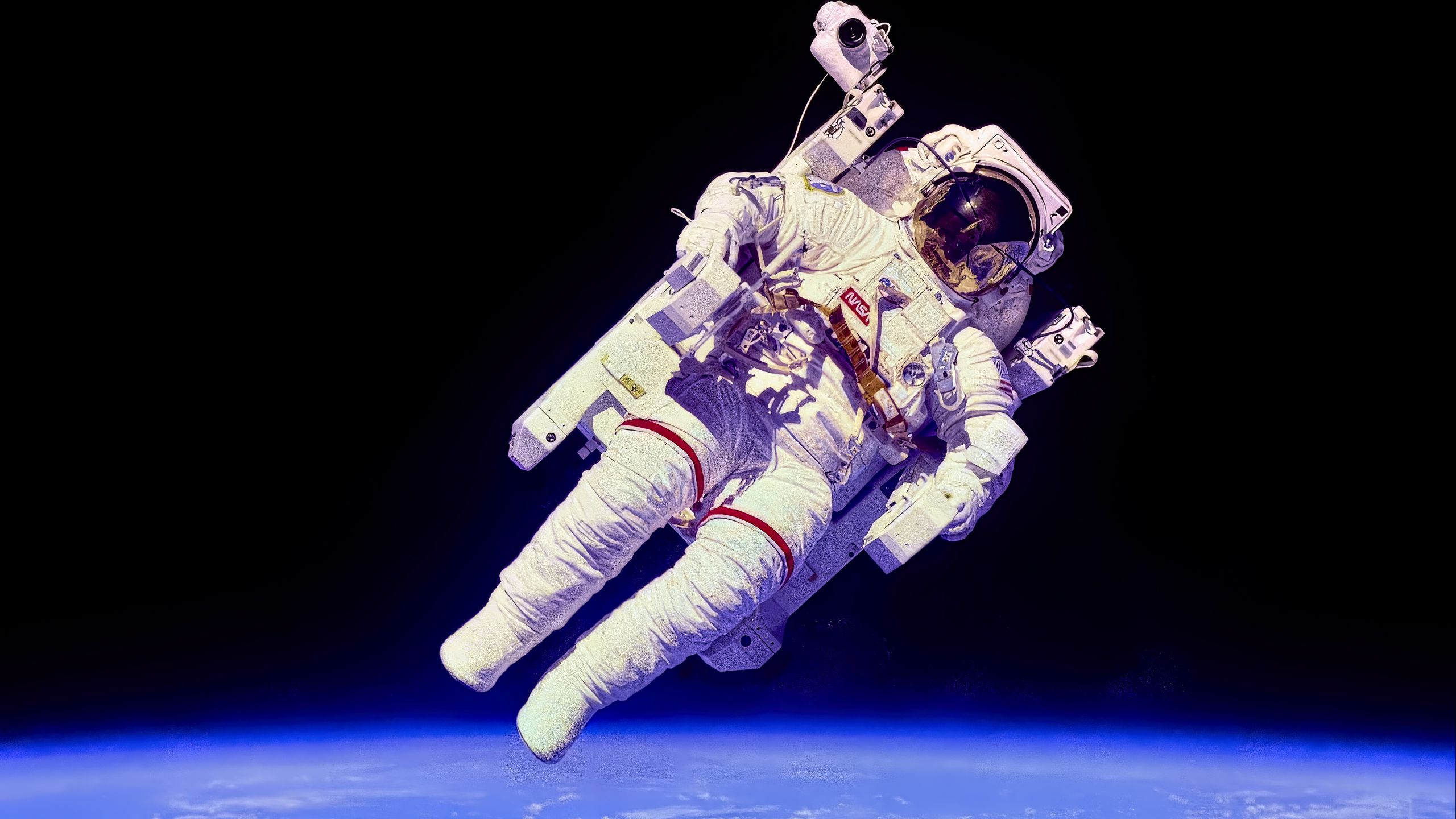 Download wallpaper 2560x1440 astronaut, weightlessness, space ...