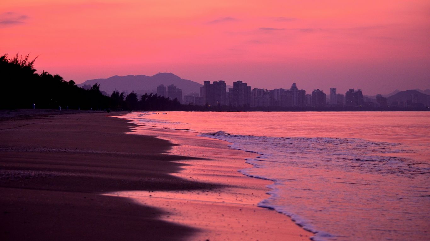 Download wallpaper 1366x768 beach, dusk, sea, coast, city tablet ...