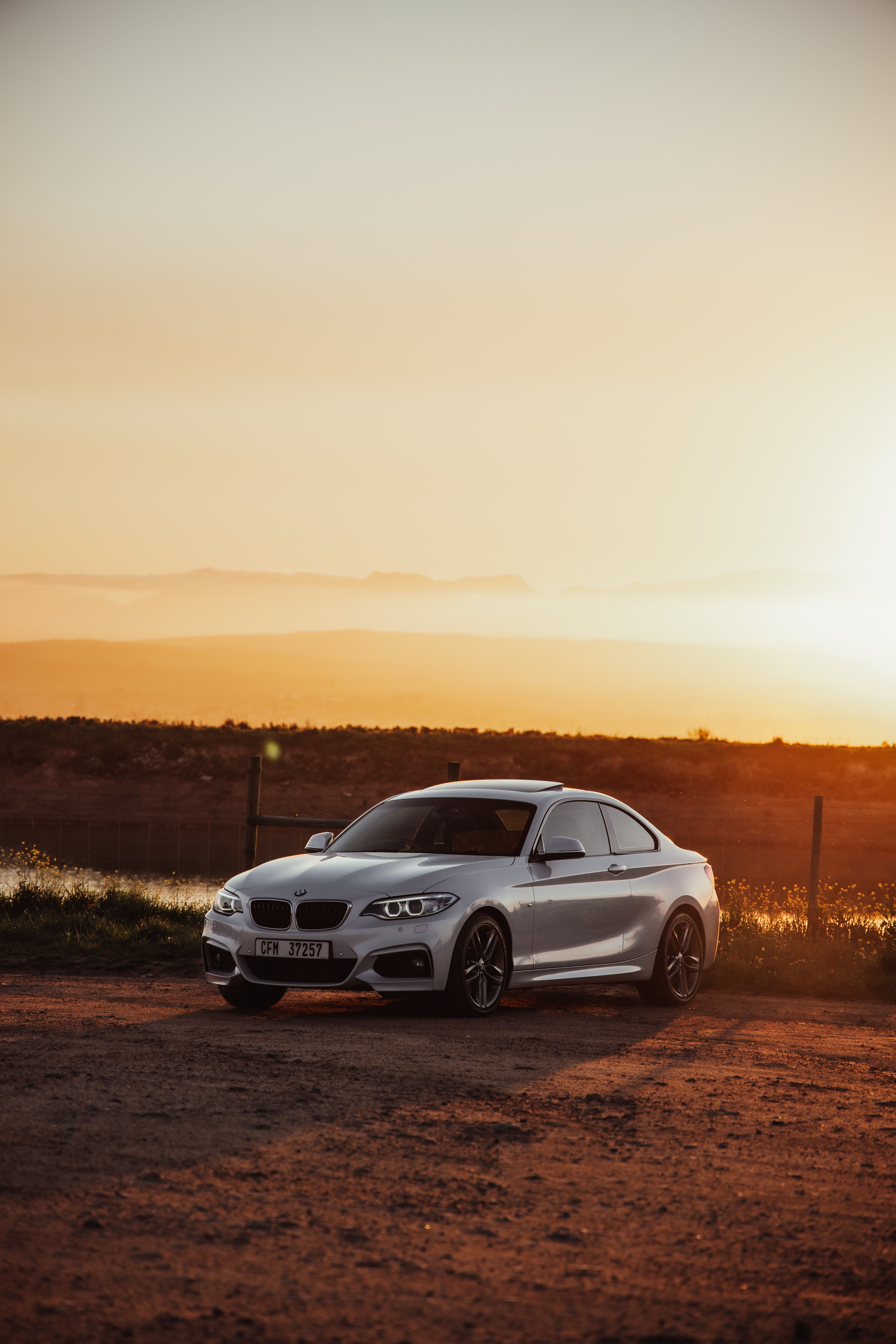 Download wallpaper 4480x6720 bmw, car, side view, gray, sunset hd ...