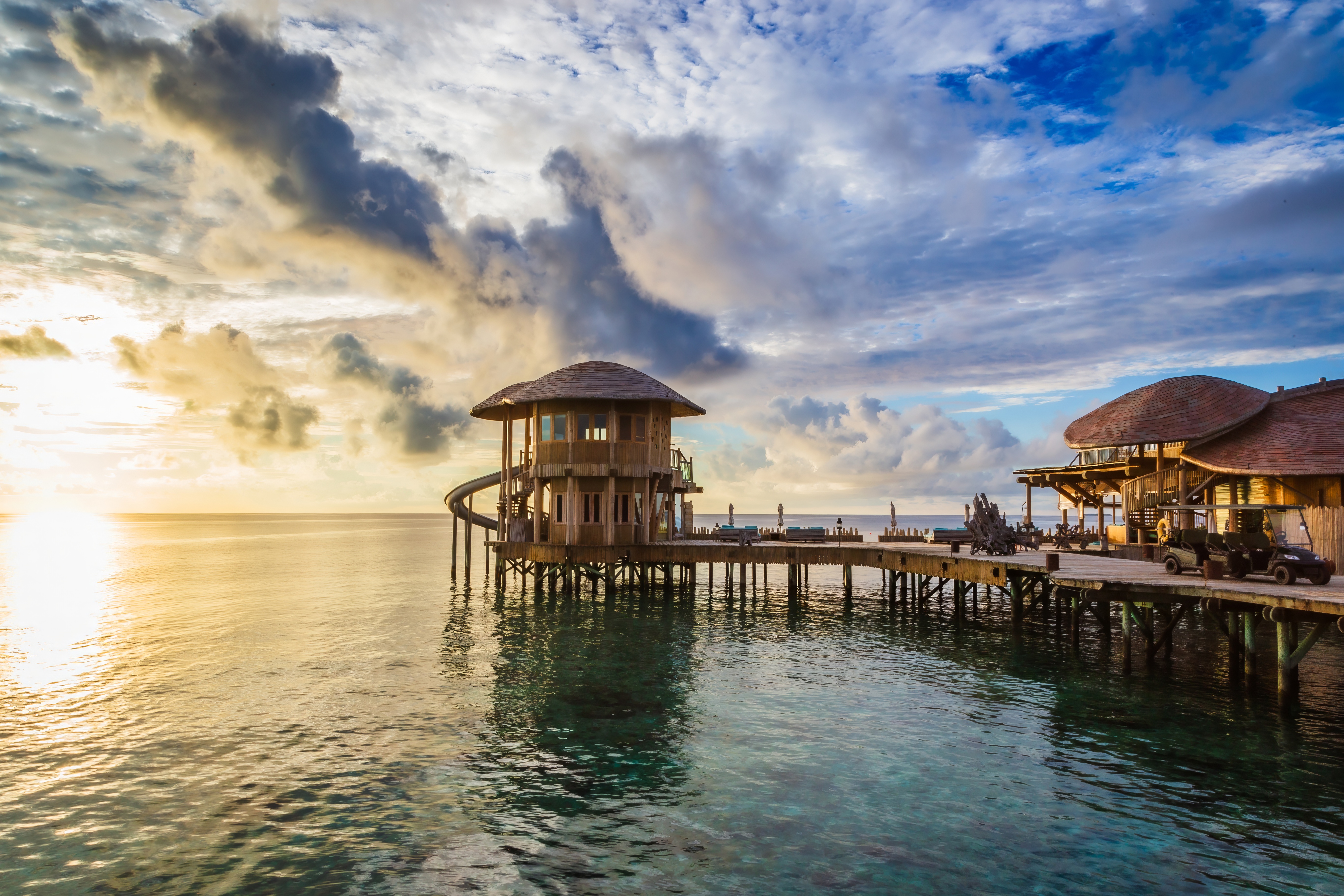 Download wallpaper 5472x3648 bridge, sea, buildings, sun, sunset hd ...