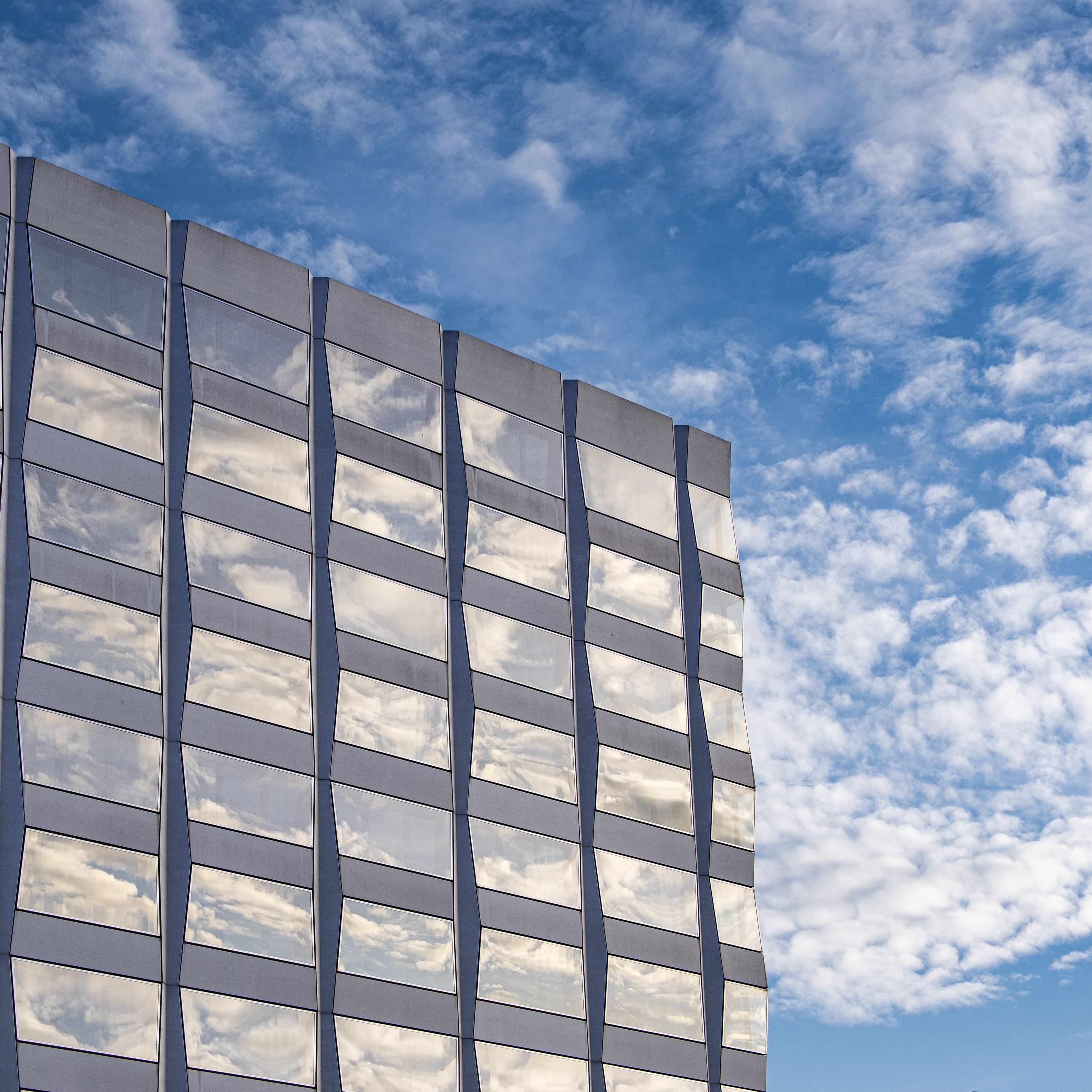 Download wallpaper 3415x3415 building, architecture, glass, clouds ...