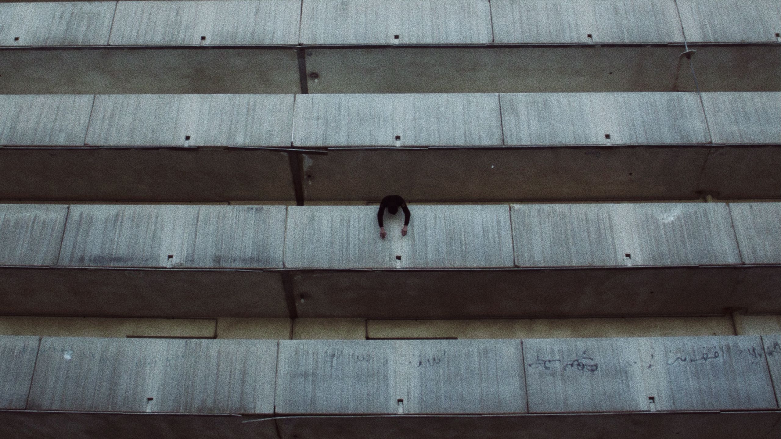Download wallpaper 2560x1440 building, balconies, man, architecture ...