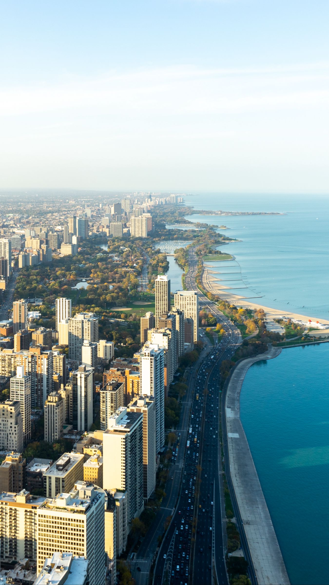 Download wallpaper 1350x2400 buildings, coast, sea, city, aerial view ...
