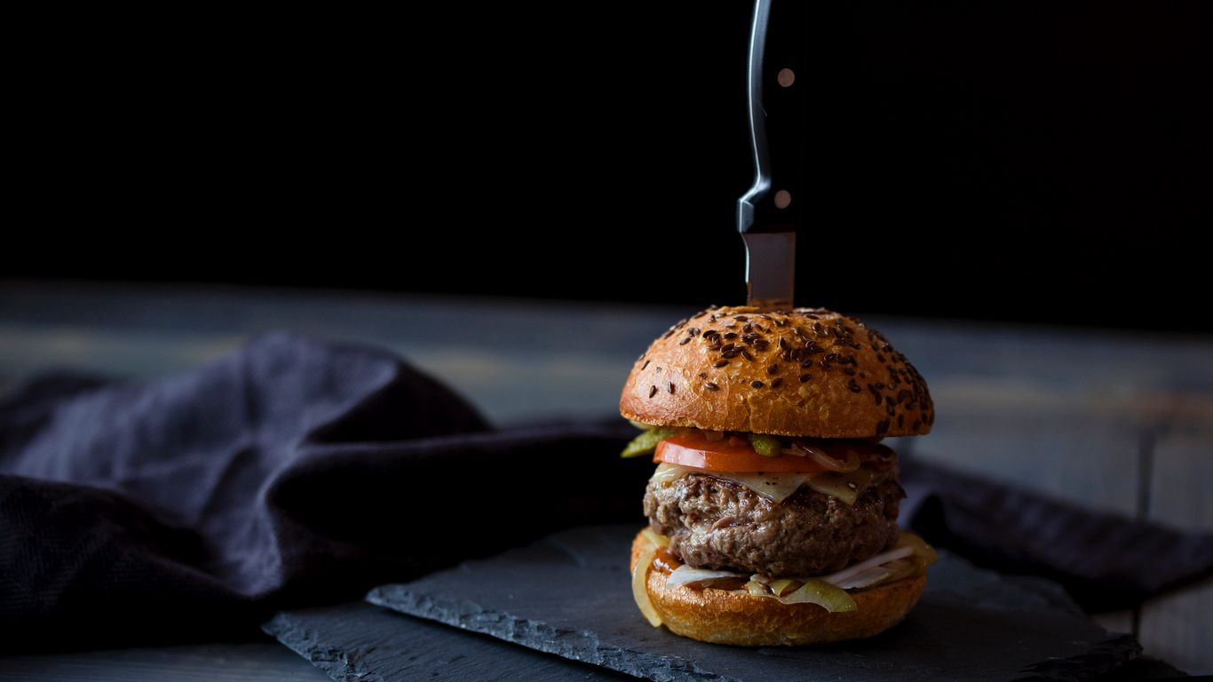 Download wallpaper 1366x768 burger, hamburger, buns, meat, knife tablet ...