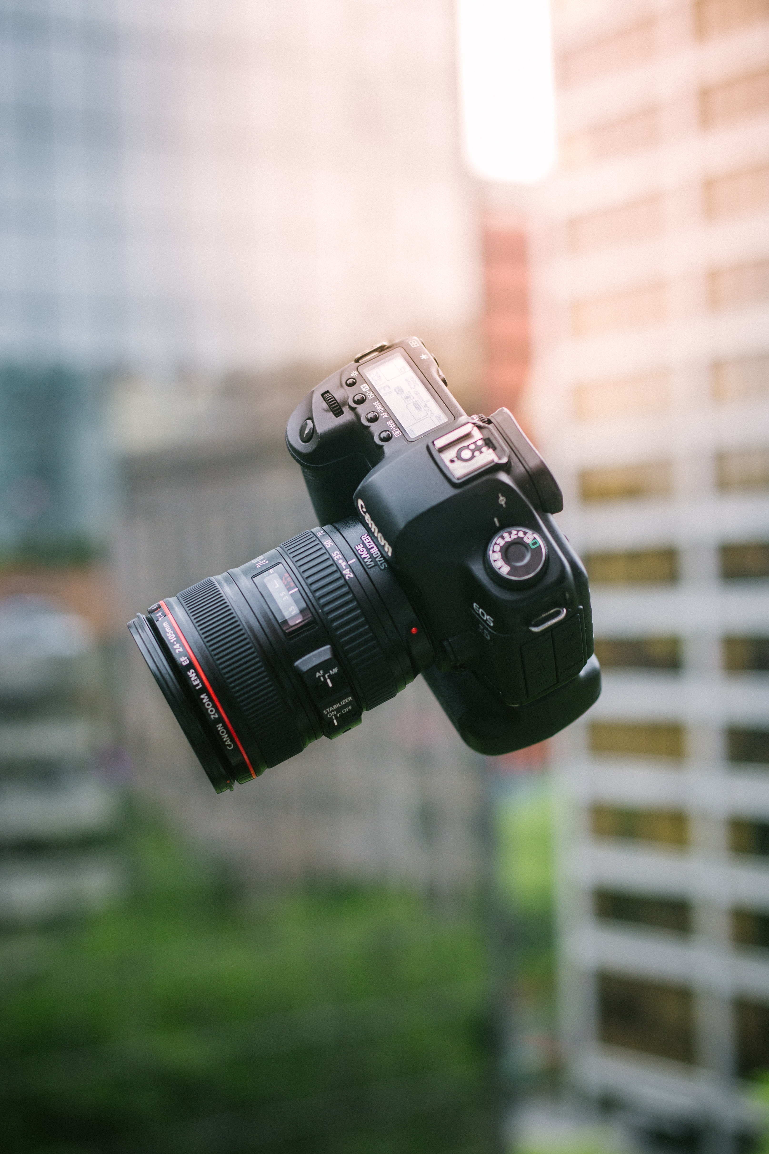 Download wallpaper 3230x4845 camera, lens, levitation, flight hd background