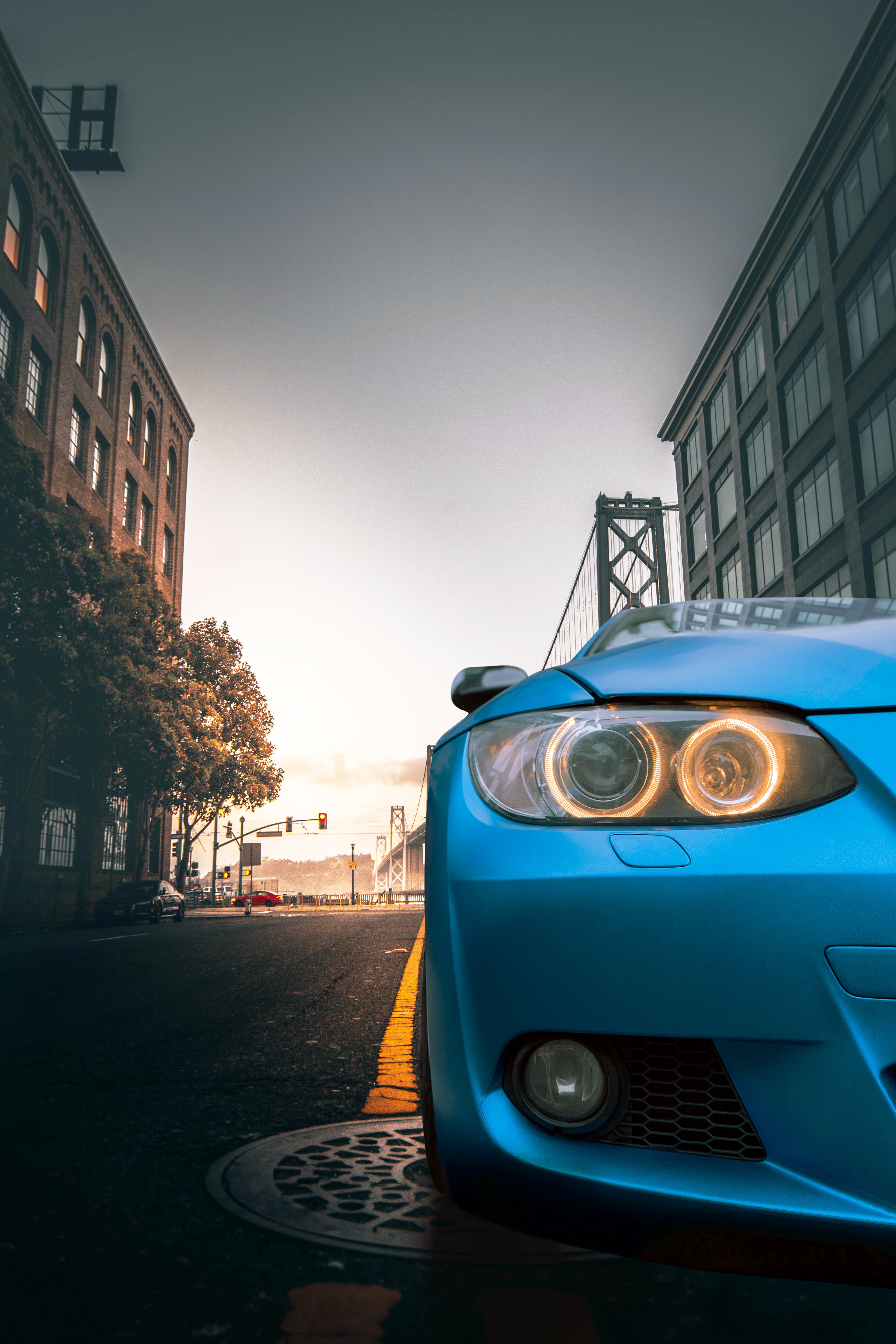 Download wallpaper 3648x5472 car, blue, headlight, road hd background