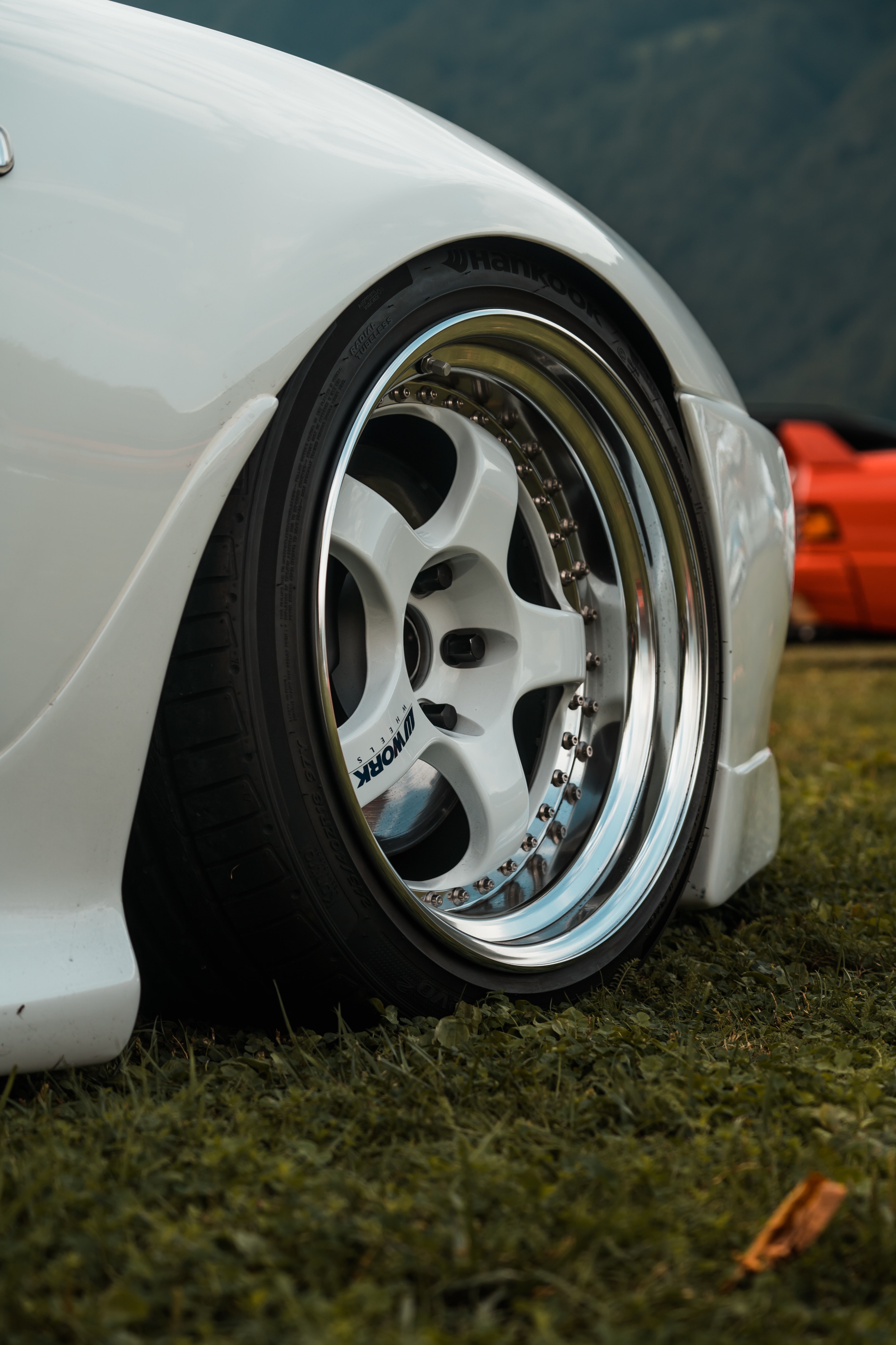 Download wallpaper 4000x6000 car, white, wheel, disc, chrome hd background