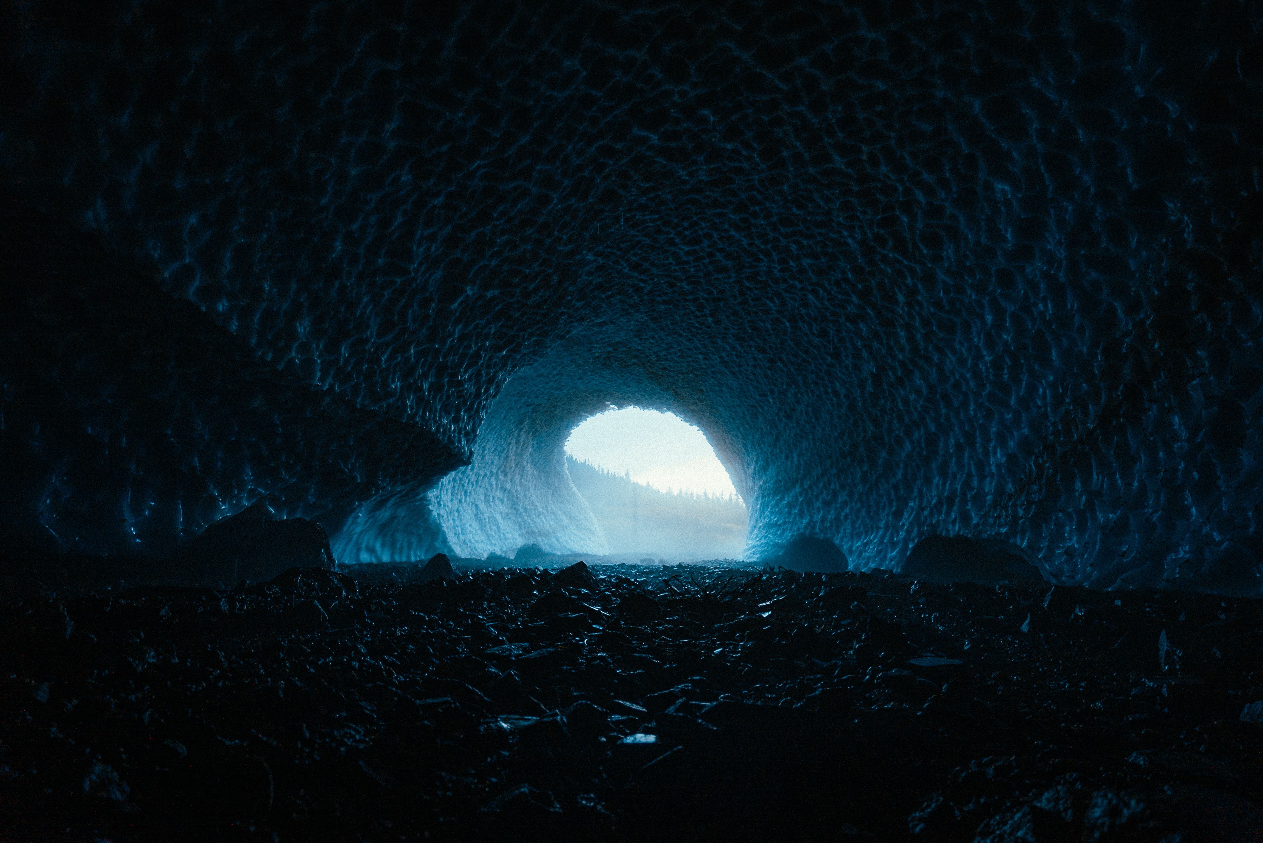 Download wallpaper 4240x2832 cave, light, tunnel, stones hd background