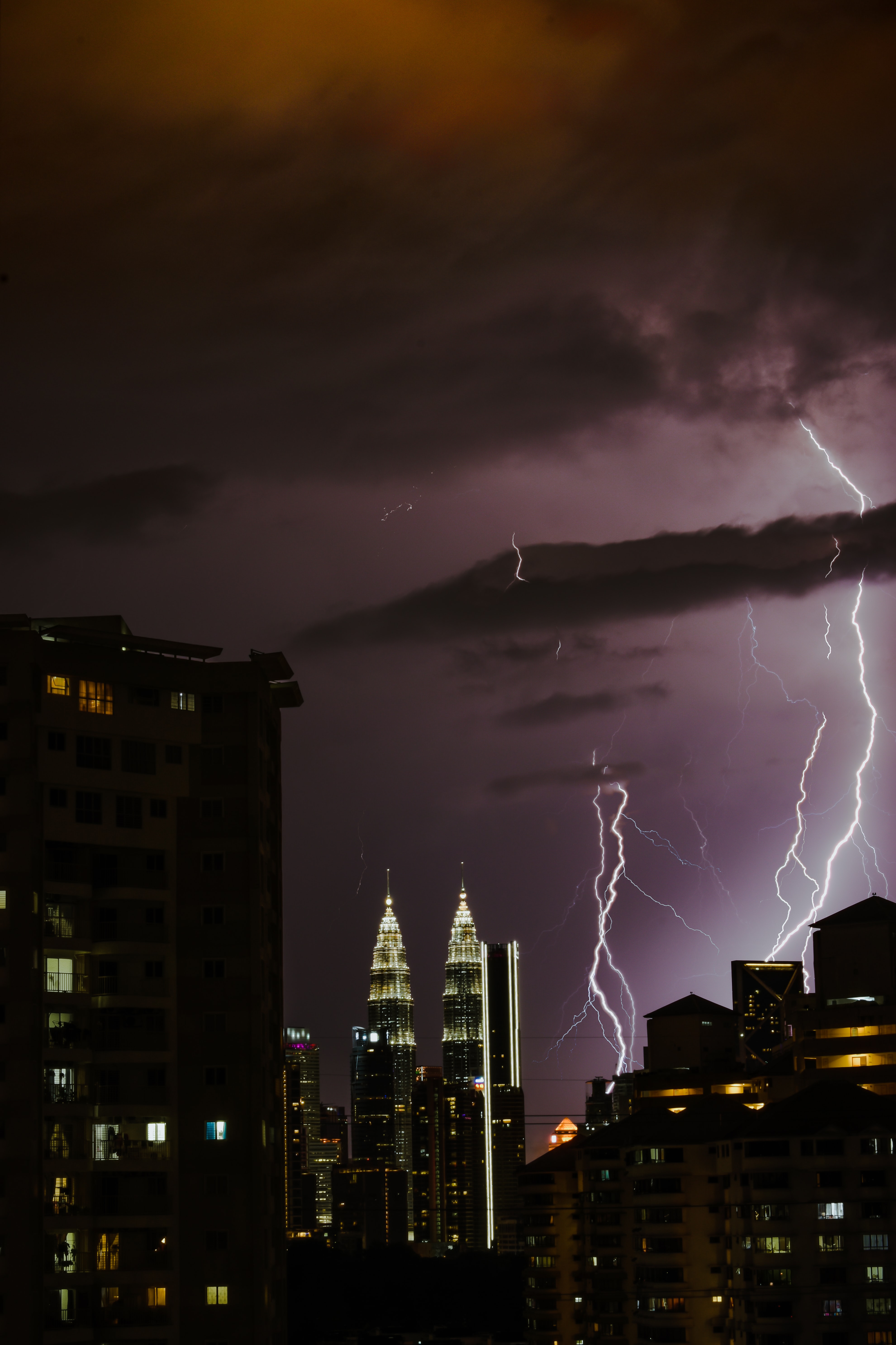 Download wallpaper 3961x5944 city, lightning, night hd background