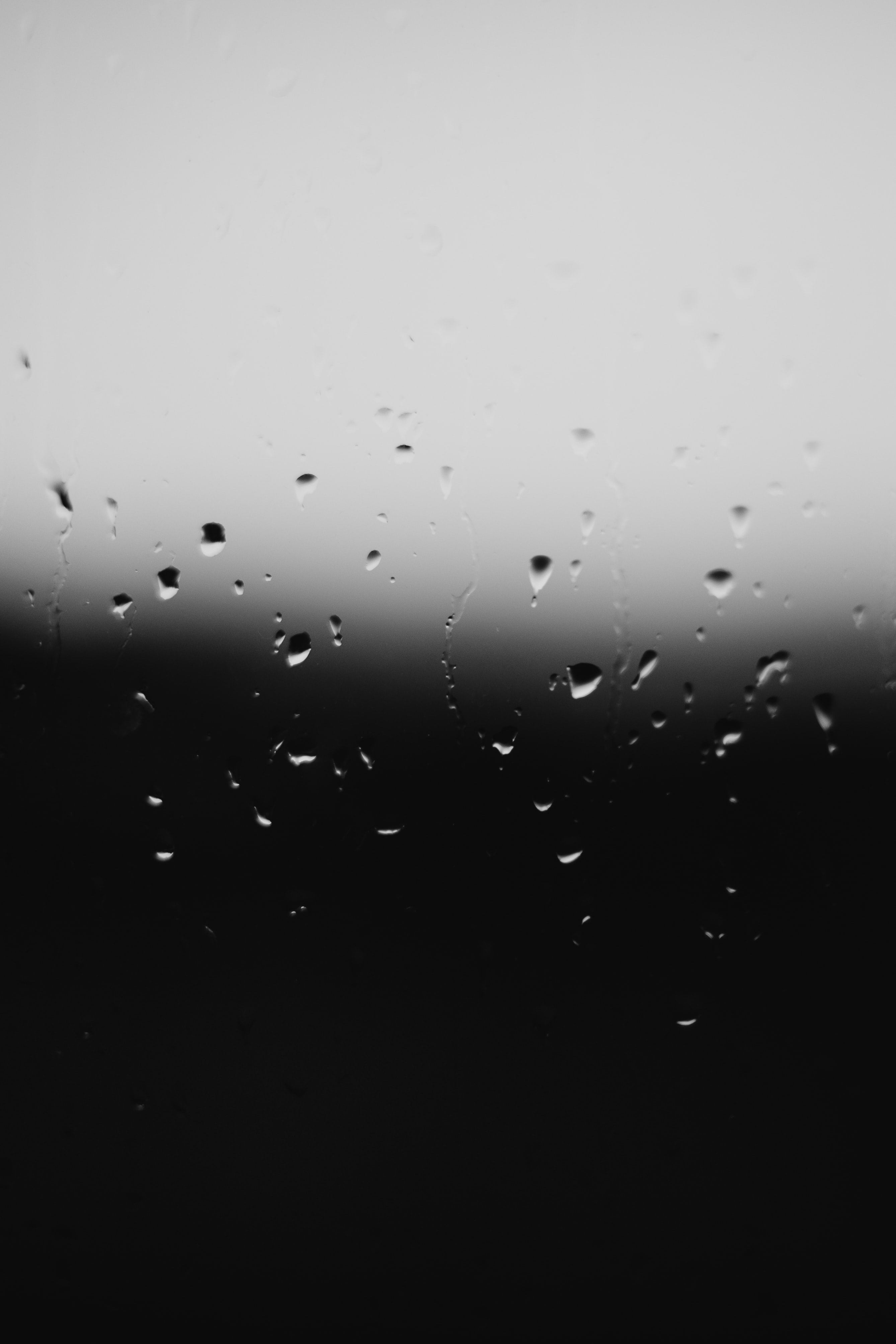 Download wallpaper 2677x4015 drops, bw, glass, water hd background
