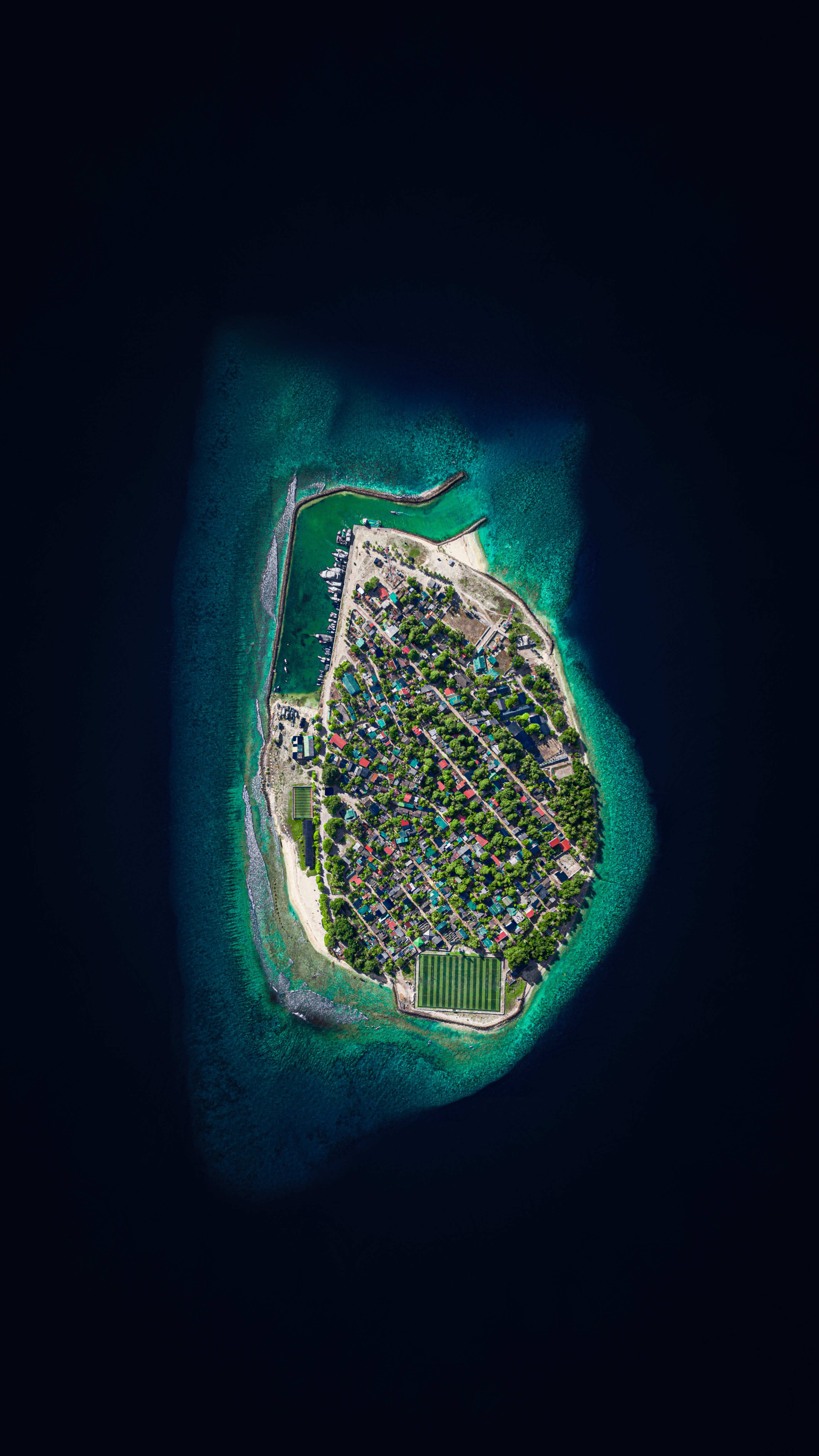 Download wallpaper 3442x6118 island, buildings, trees, water hd background