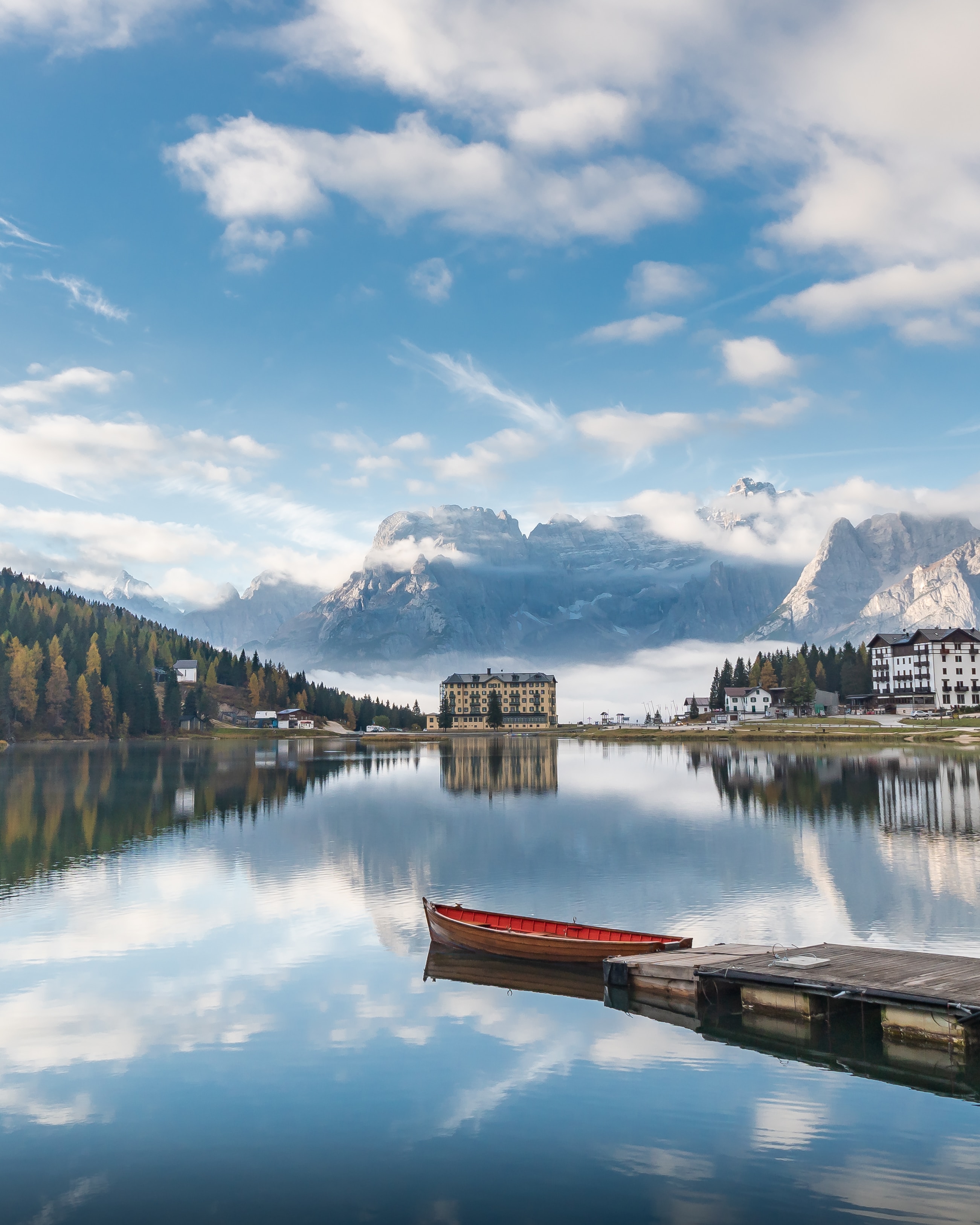 Download wallpaper 2602x3252 lake, mountains, buildings, pier, boat ...