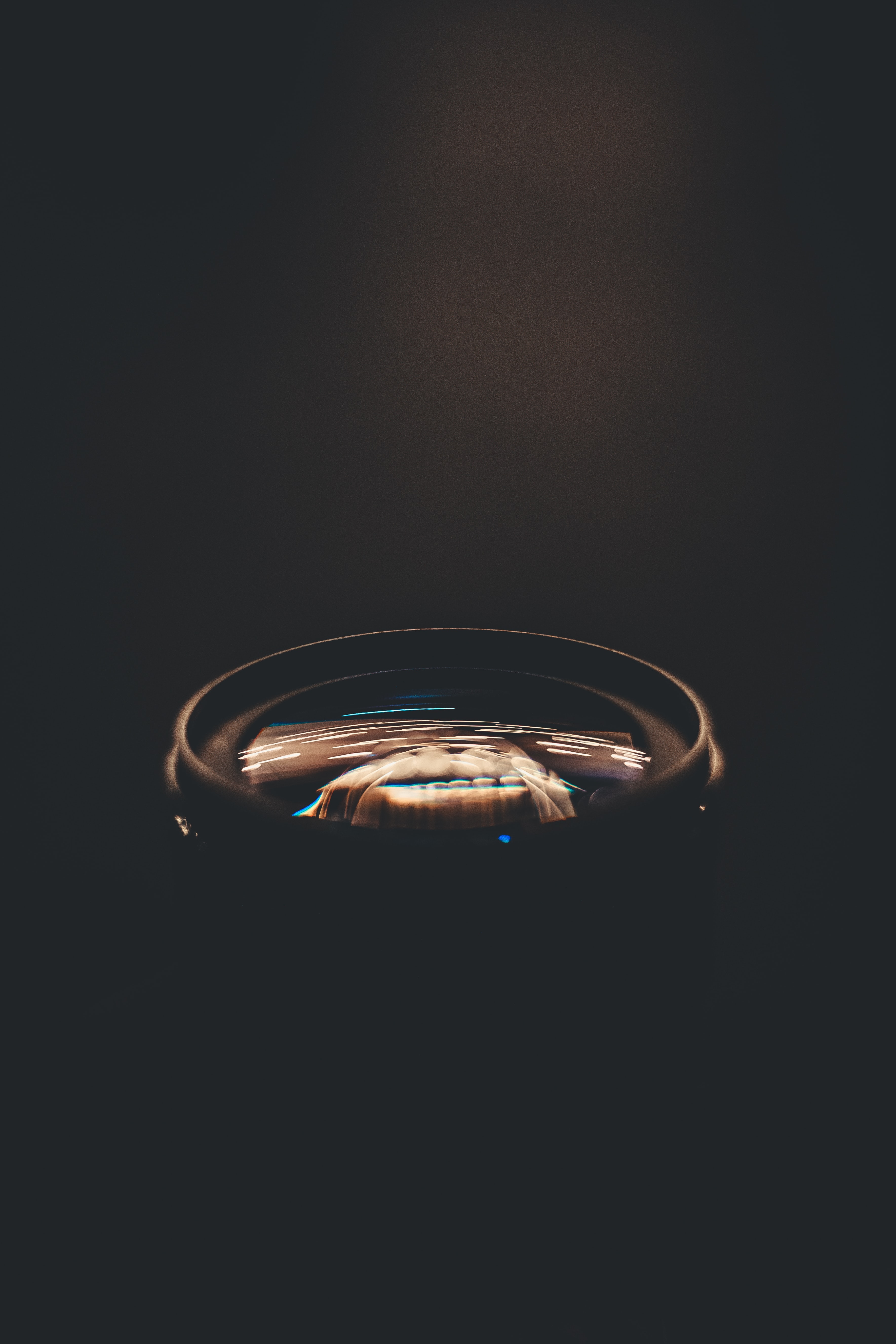 Download wallpaper 3538x5307 lens, glass, reflection, dark hd background