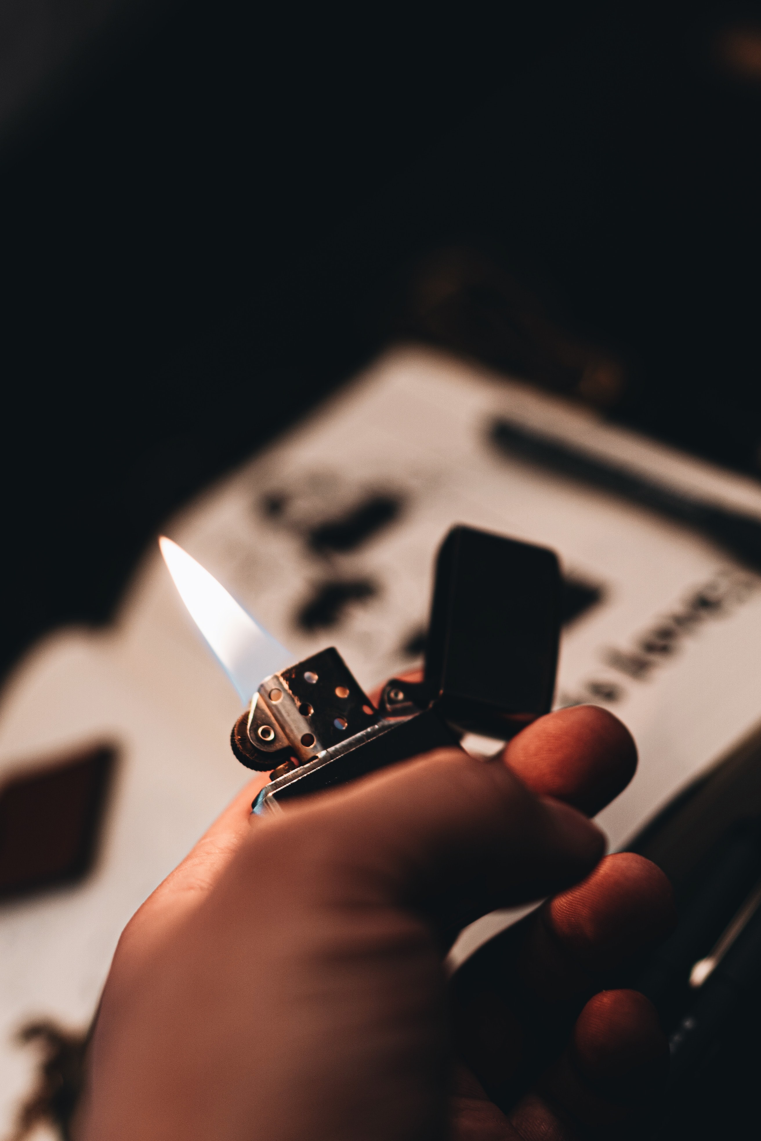 Download wallpaper 2624x3936 lighter, hand, fire hd background