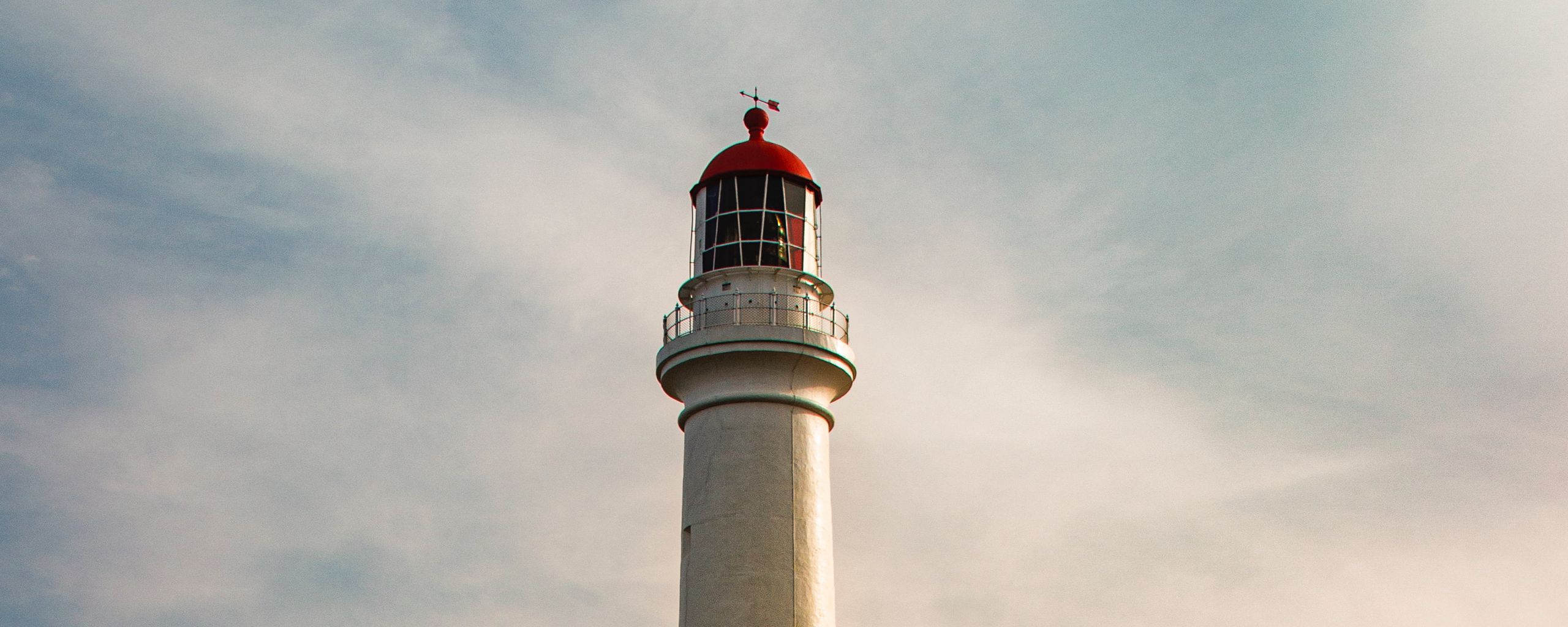 Download wallpaper 2560x1024 lighthouse, building, bushes, sky ...
