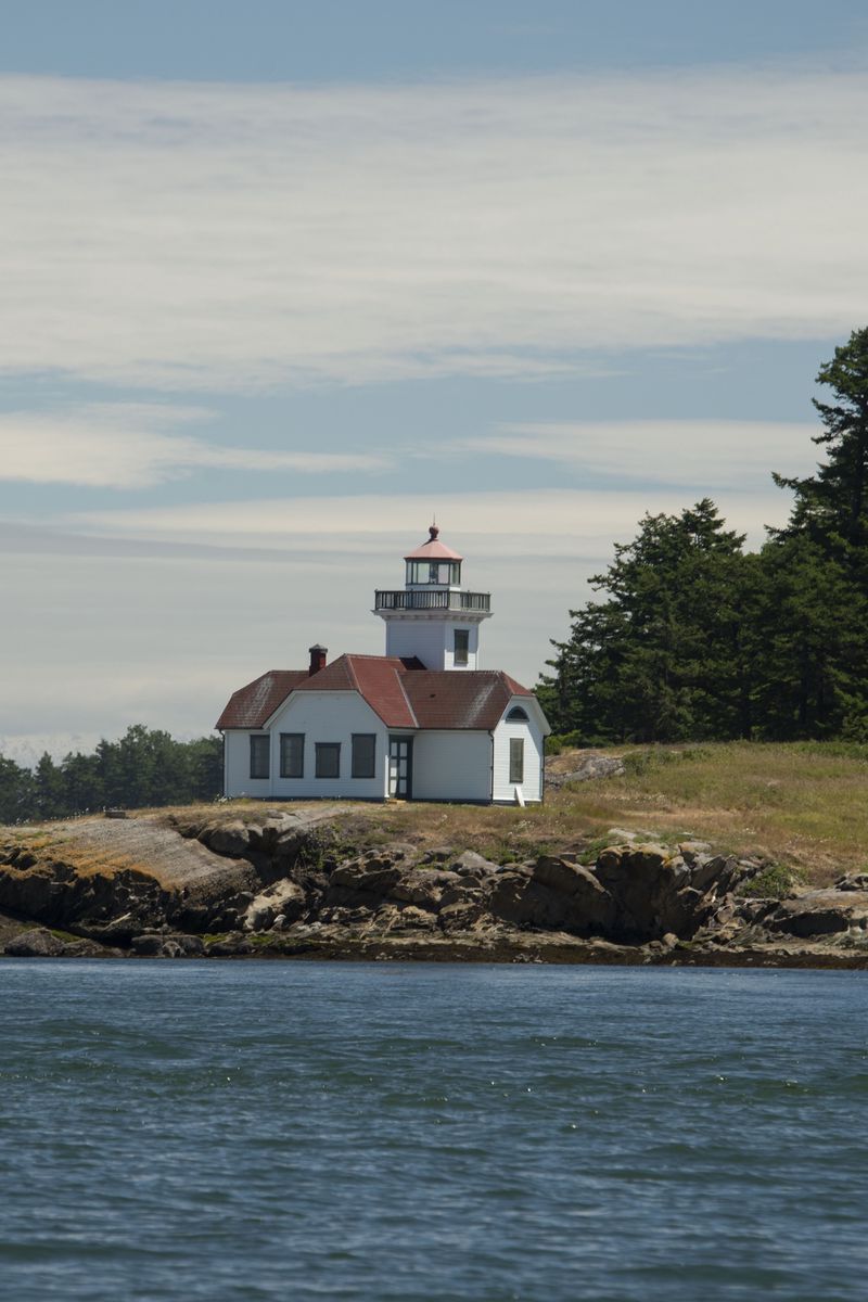 Download wallpaper 800x1200 lighthouse, building, sea, coast, tree ...