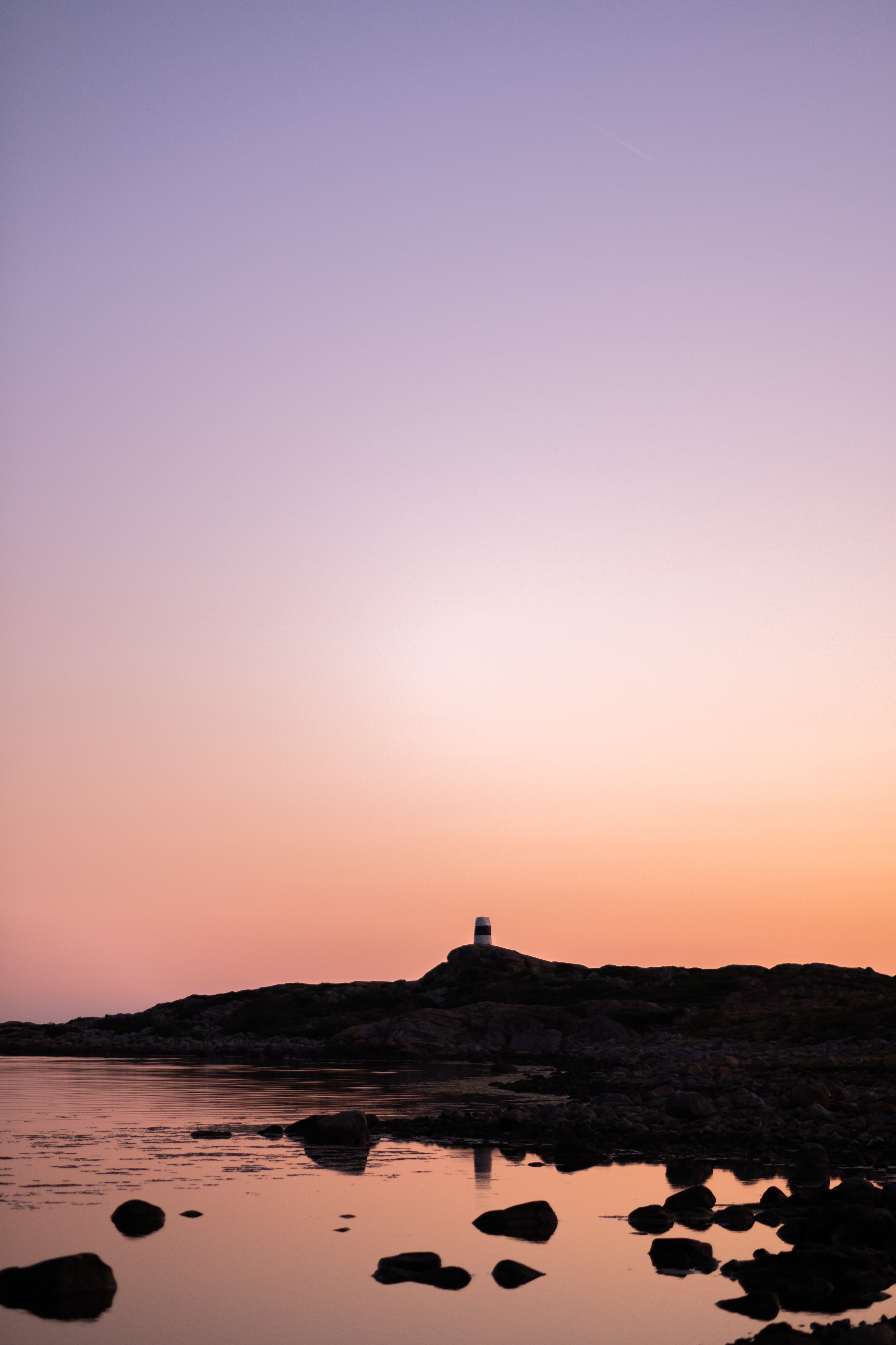 Download wallpaper 4160x6240 lighthouse, rocks, dusk, sunset, sea hd ...