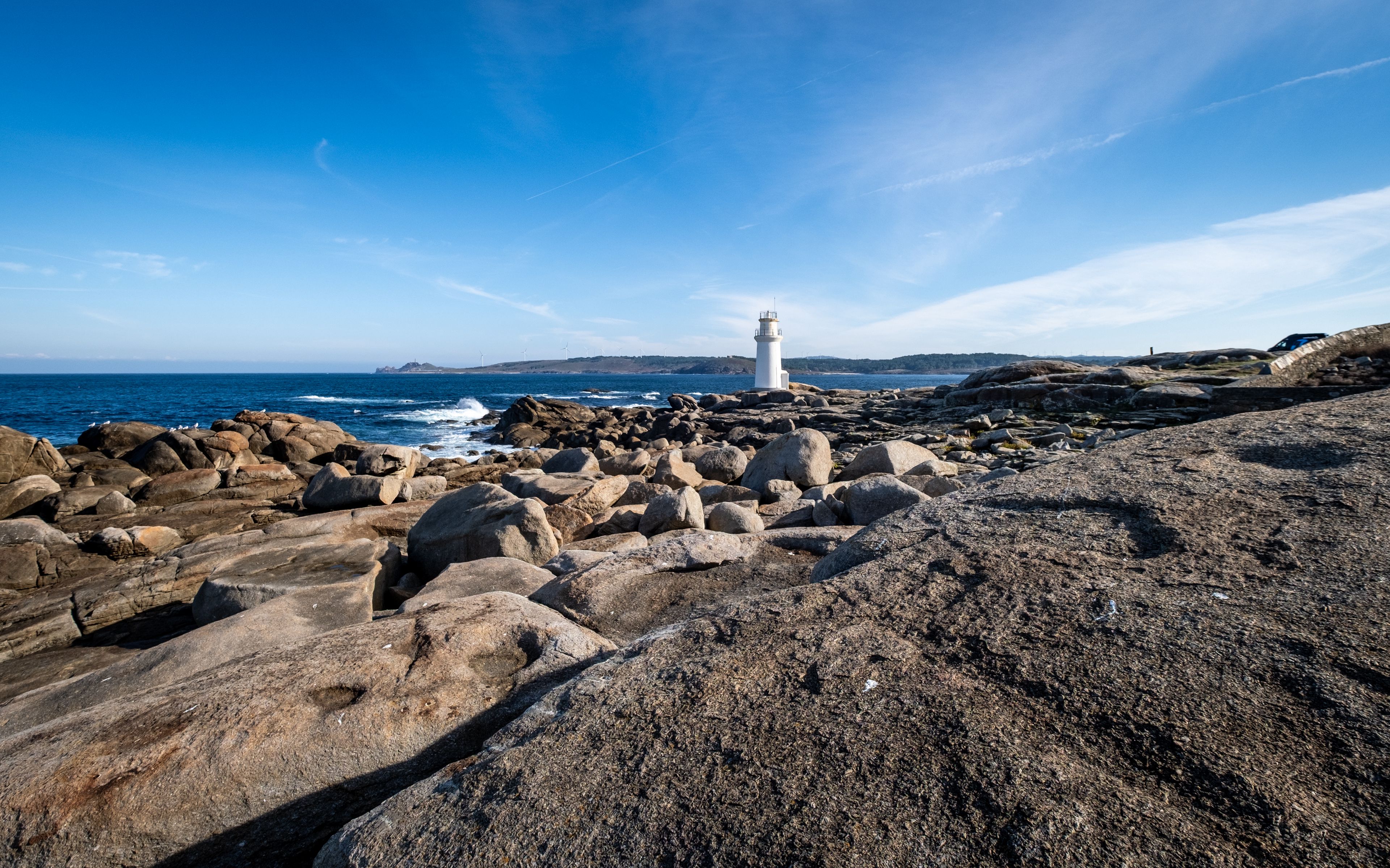 Download wallpaper 3840x2400 lighthouse, rocks, stones, sea, clouds ...