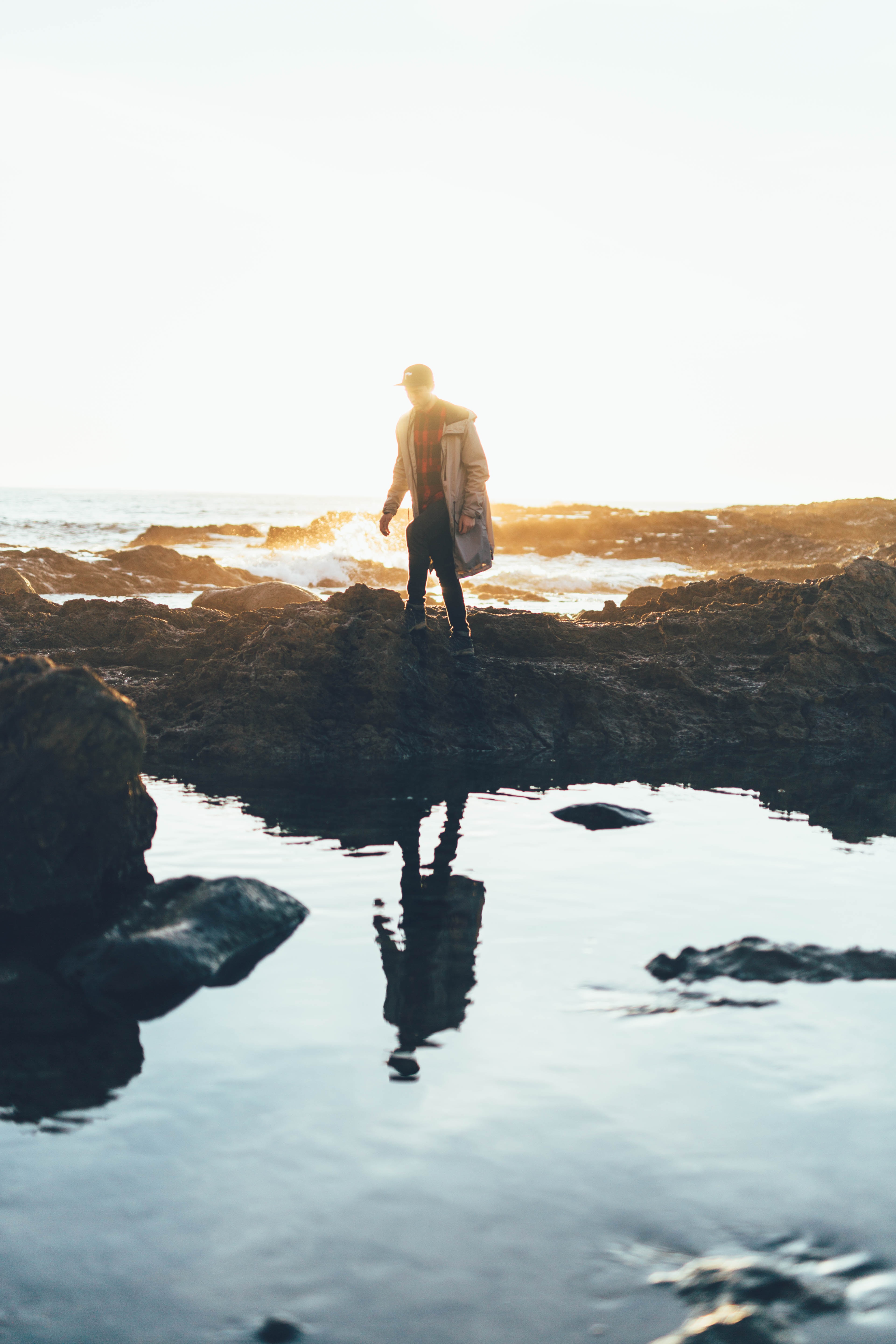 Download wallpaper 3840x5760 man, sea, coast, sunlight, waves hd background