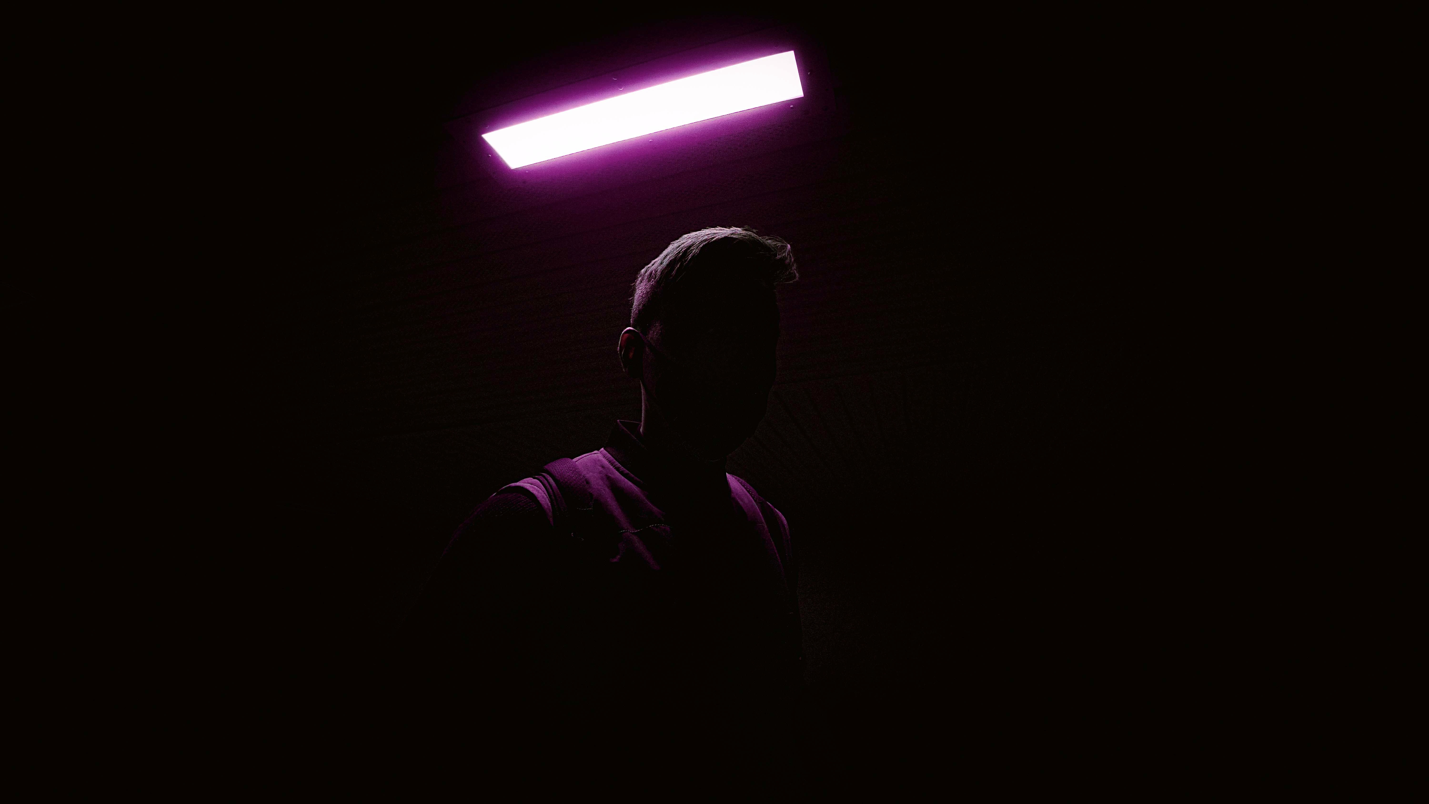 Download wallpaper 6000x3376 man, shadow, neon, glow hd background