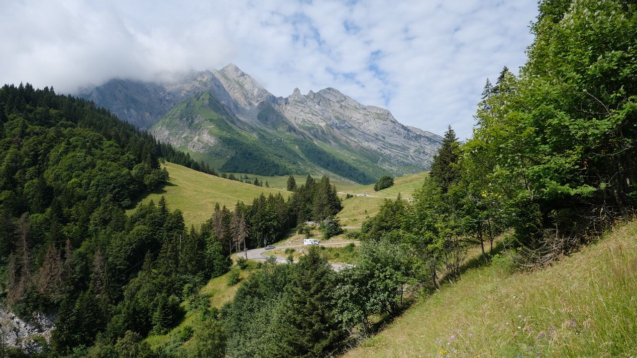 Wallpaper mountains, trees, clouds, grass, slope hd, picture, image