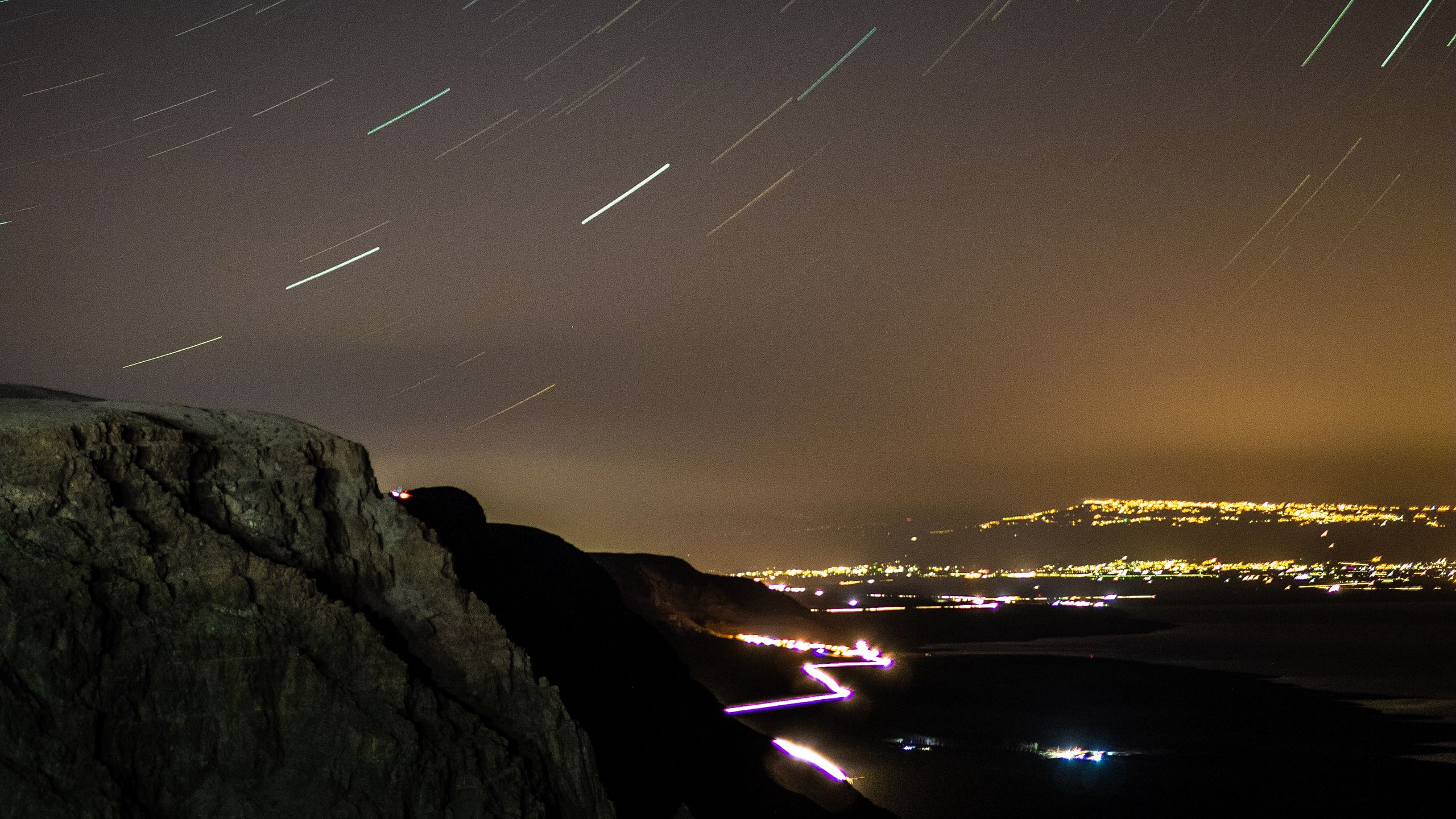 Download wallpaper 2560x1440 night city, starry sky, long exposure ...