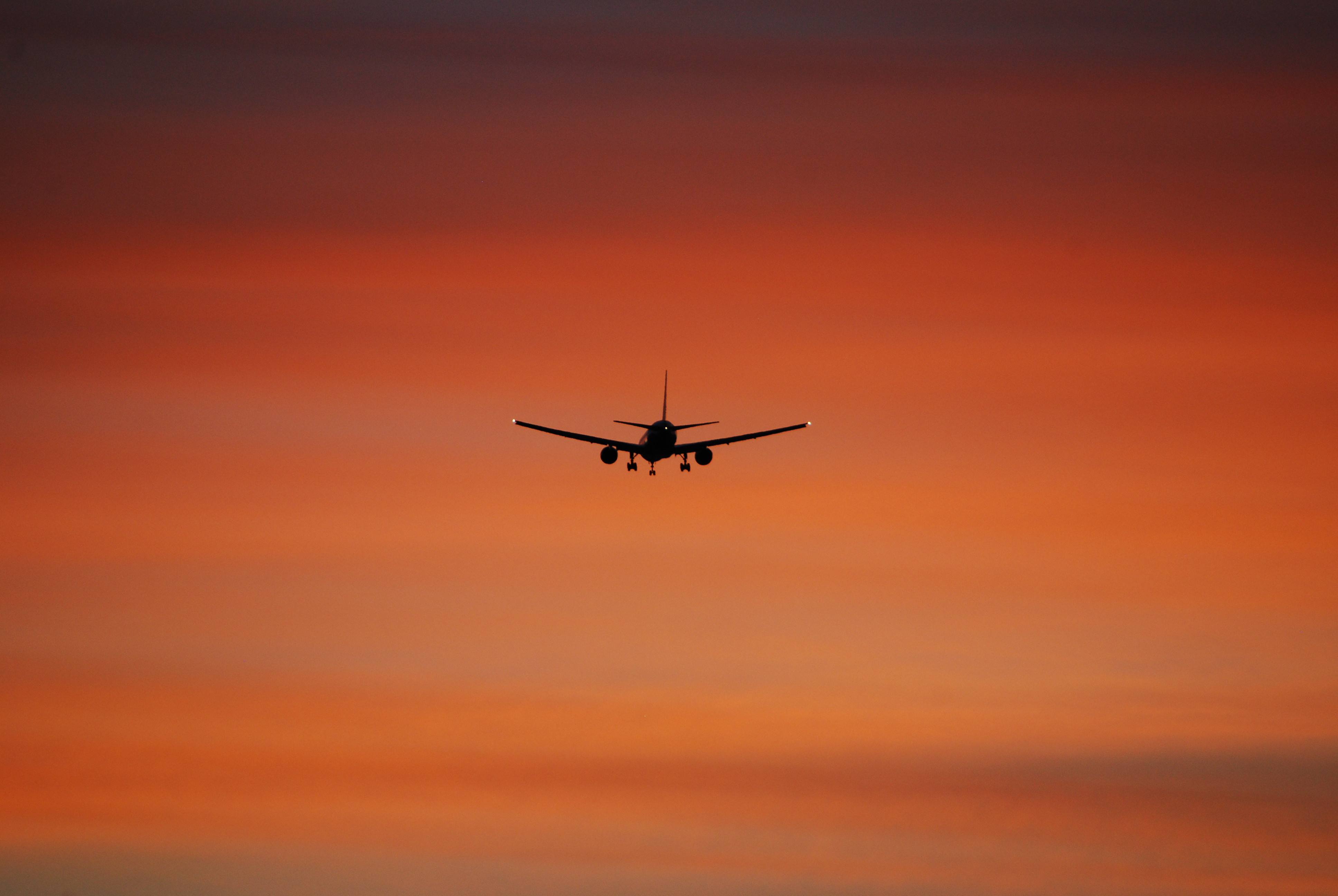 Download wallpaper 3872x2592 plane, sky, dusk, red hd background