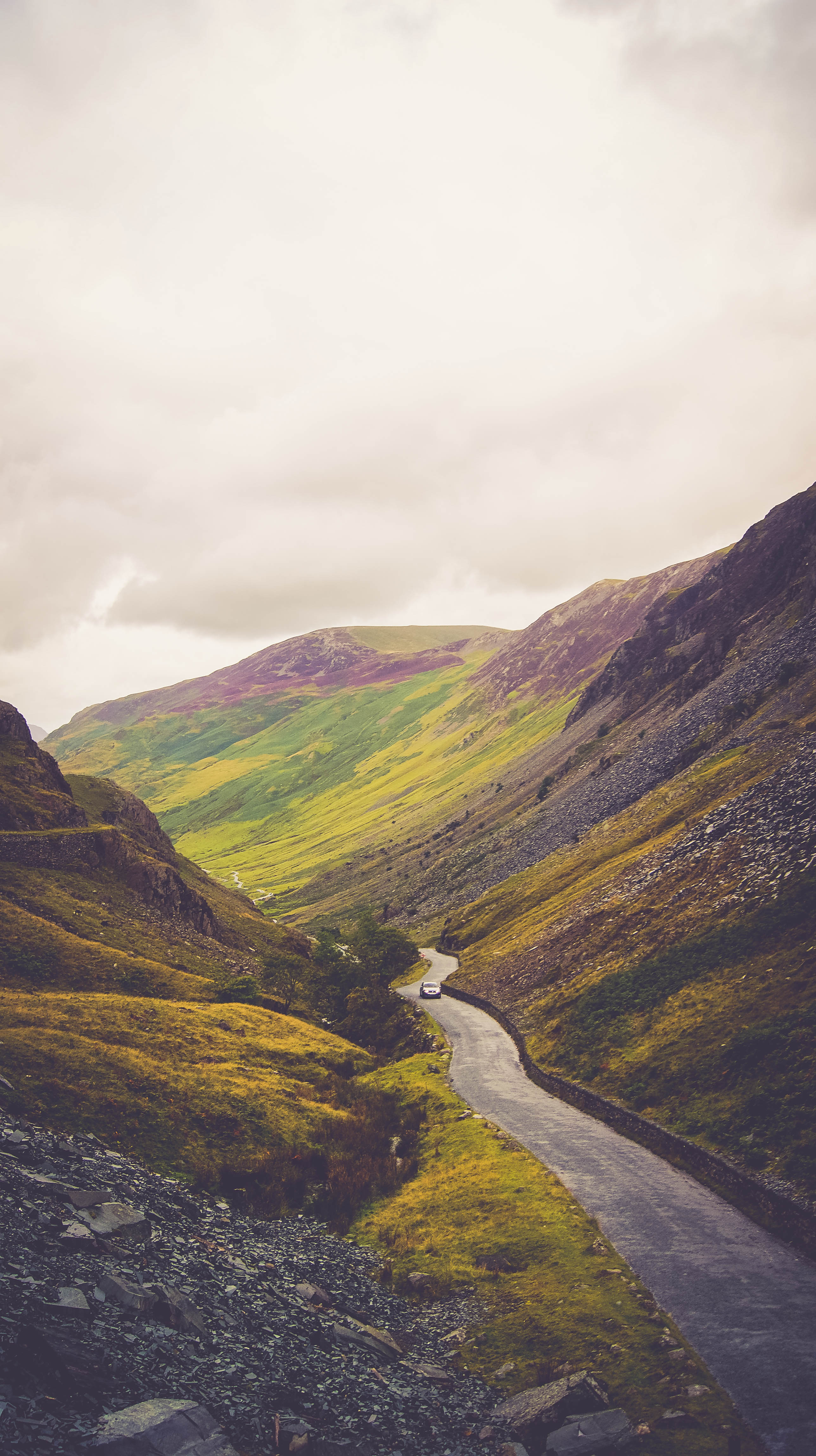 Download wallpaper 2576x4592 road, car, mountains, slope hd background