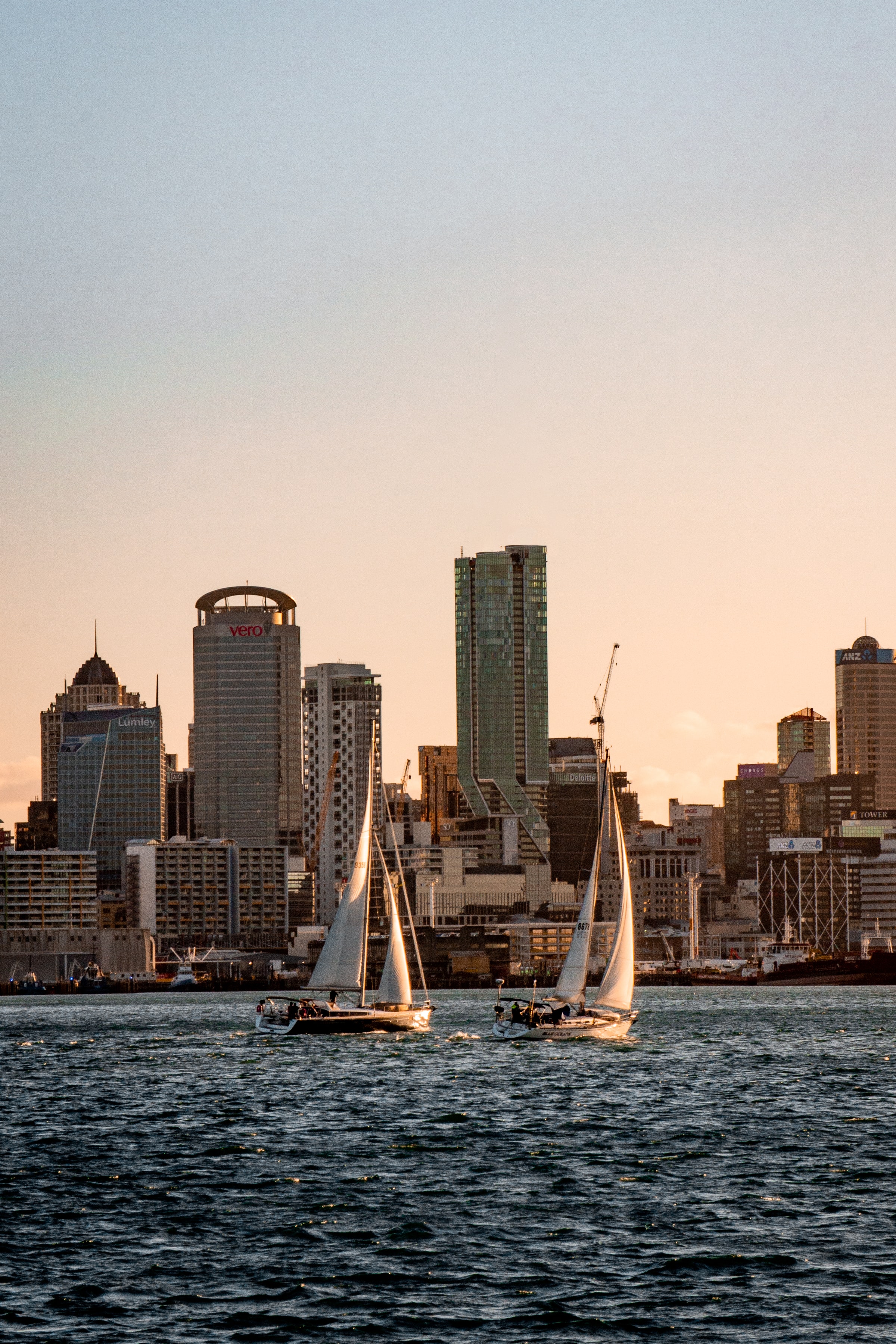 Download wallpaper 2400x3600 sailboat, city, buildings, skyscrapers ...