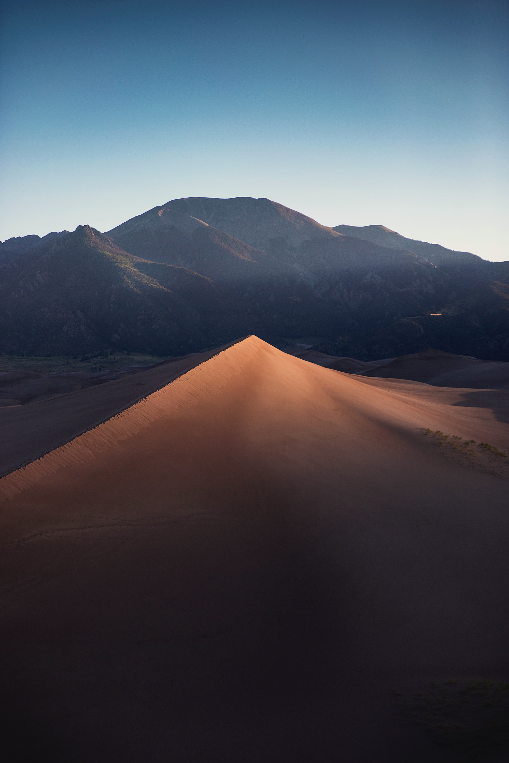 Download wallpaper 2000x3000 sand, mountains, hills, sky hd background