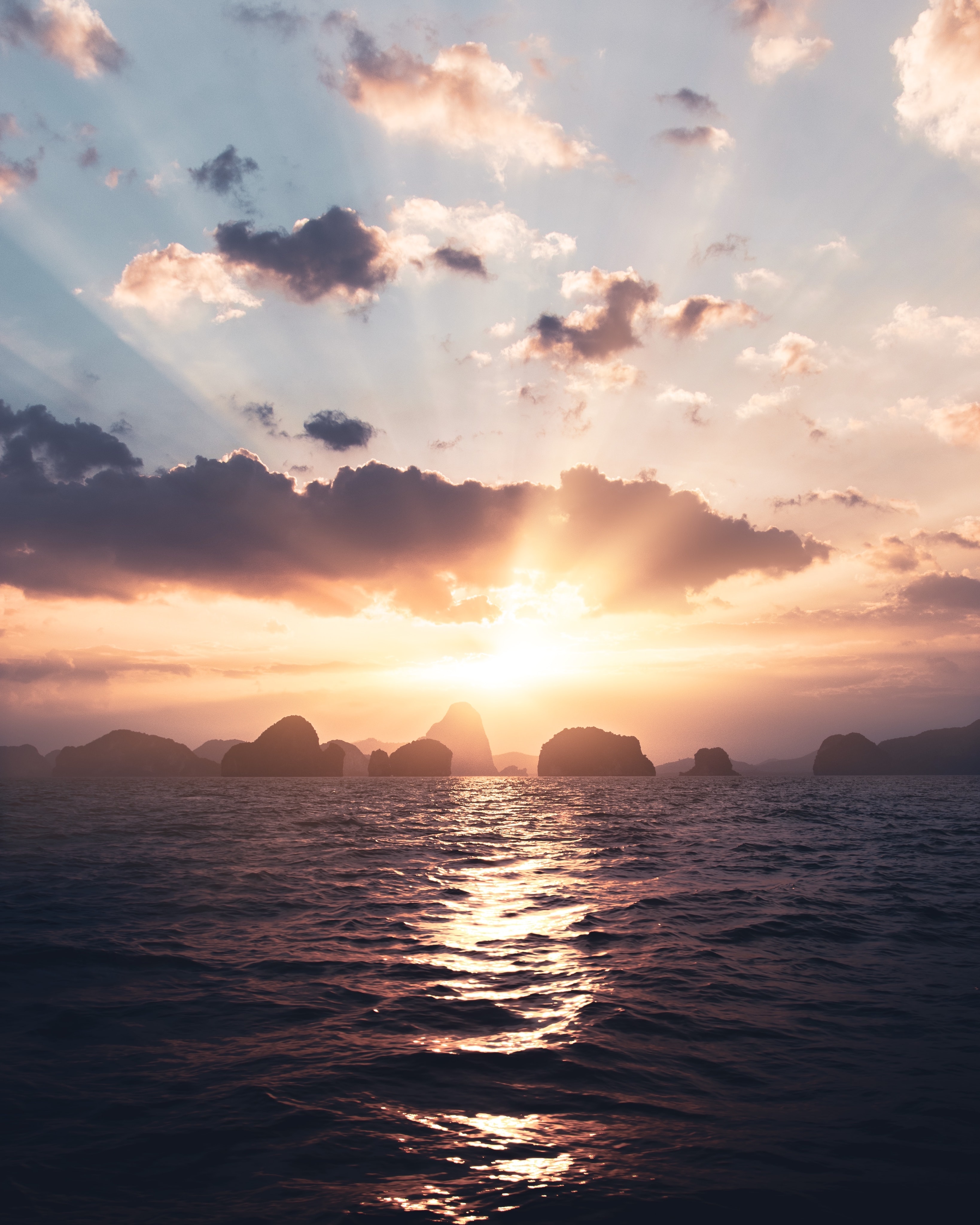 Download wallpaper 3276x4096 sea, rays, sun, rocks, sunset hd background