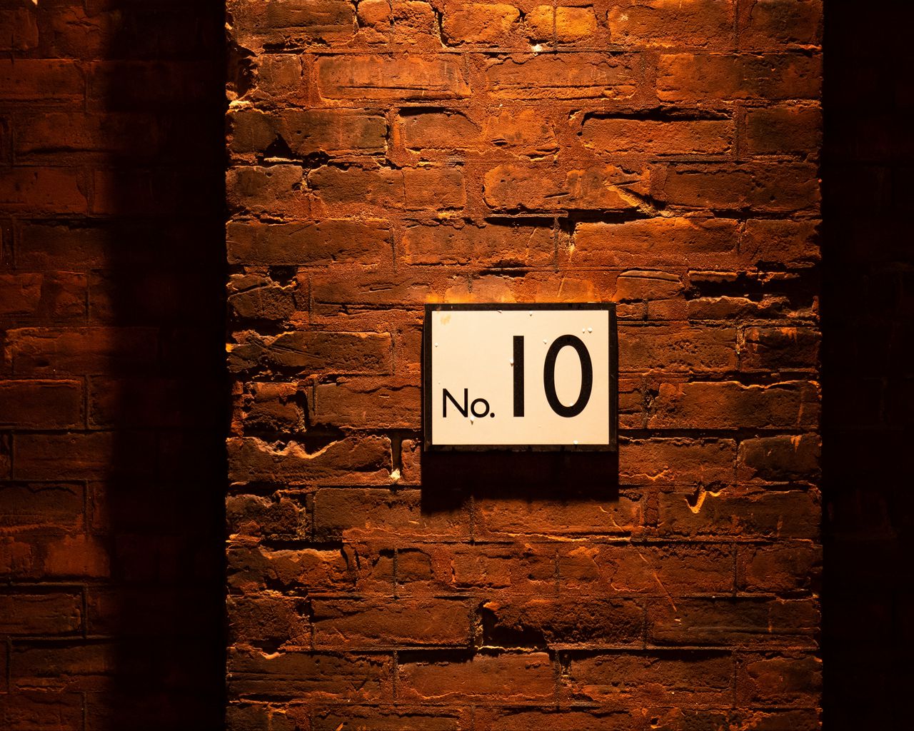 Download wallpaper 1280x1024 sign, number, wall standard 5:4 hd background