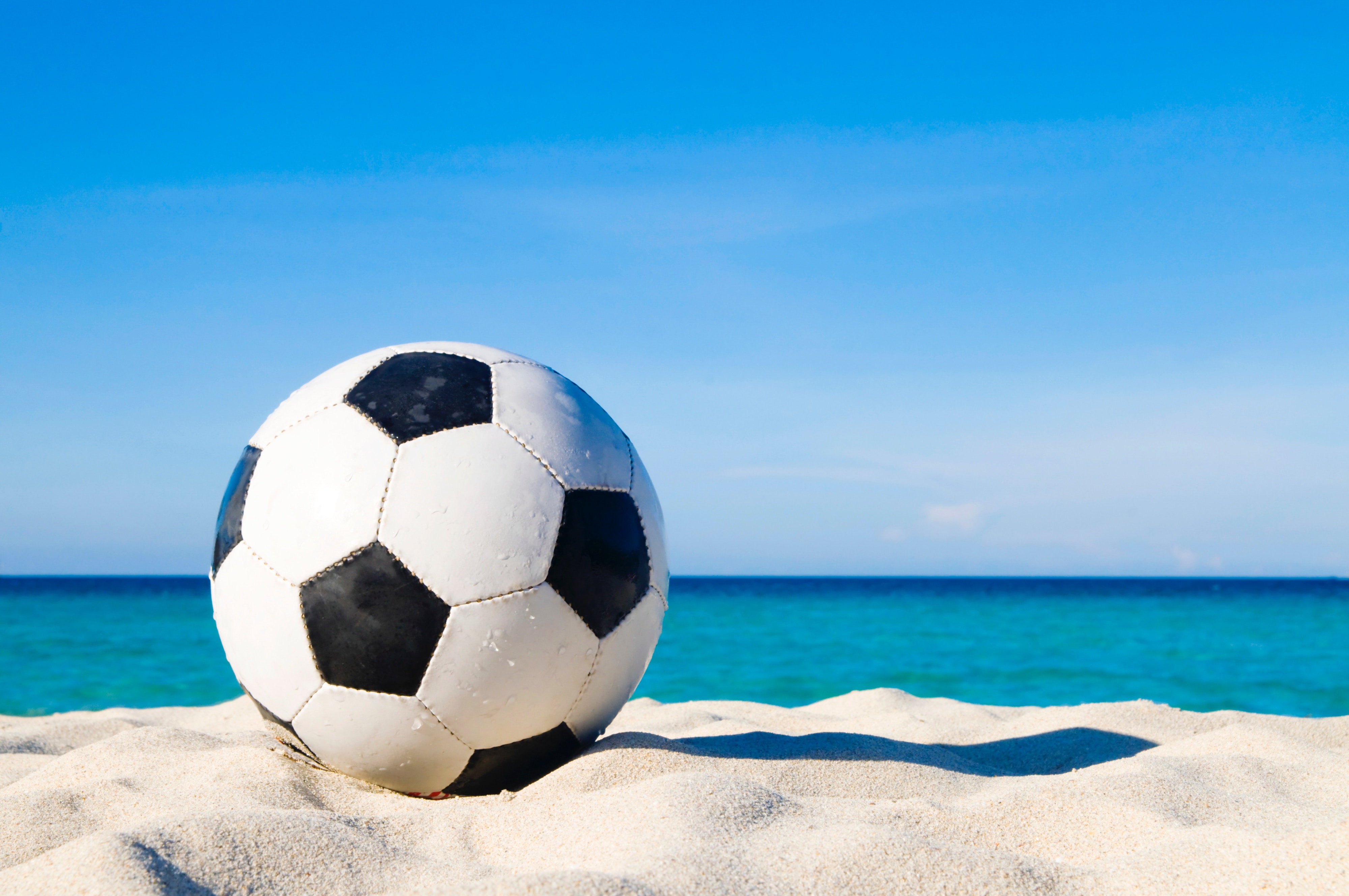 Download wallpaper 4000x2657 soccer ball, football, sand hd background
