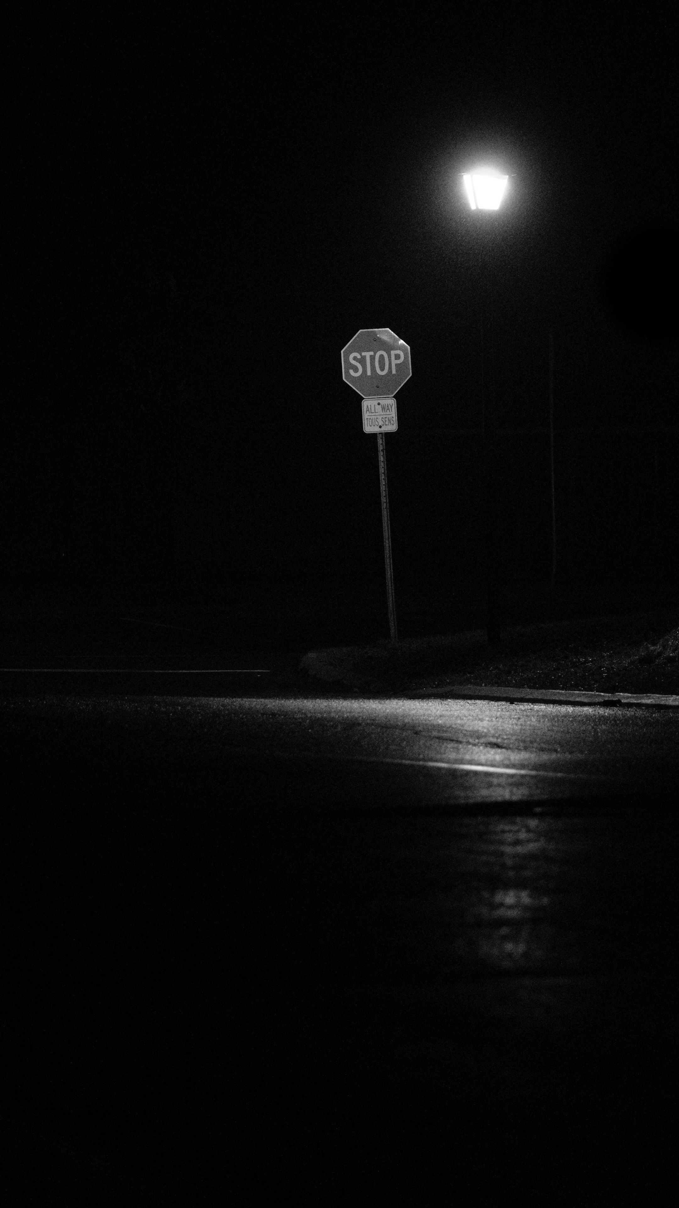 Download wallpaper 2160x3840 stop, sign, road, night, black and white ...