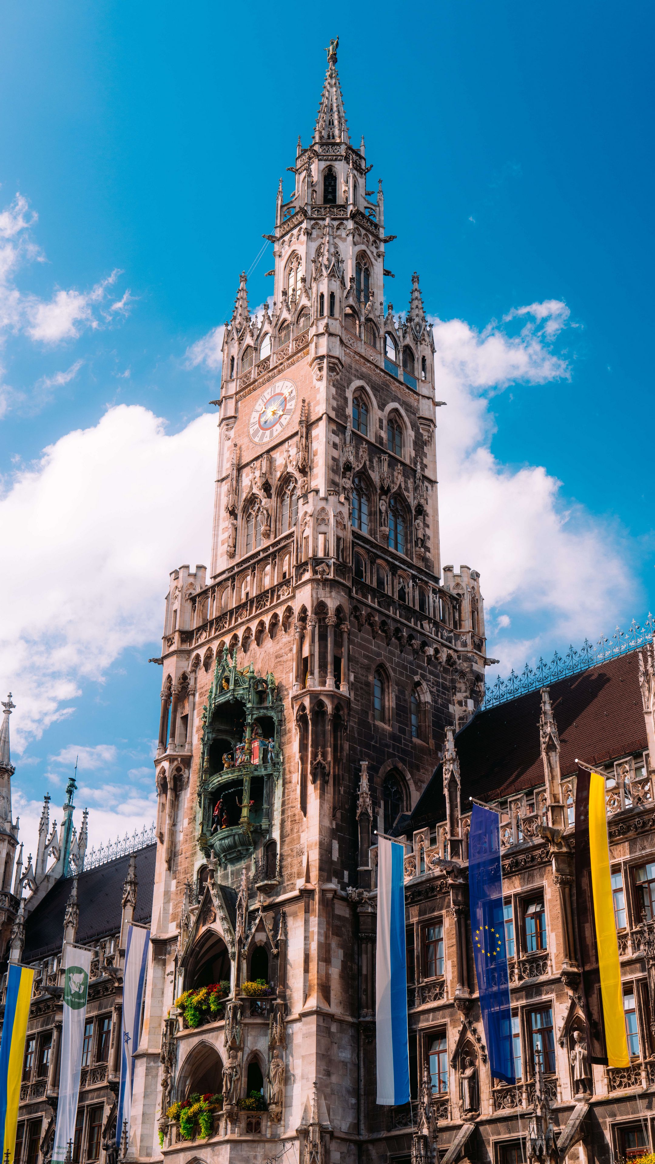 Download wallpaper 2160x3840 town hall, flags, tower, clock ...