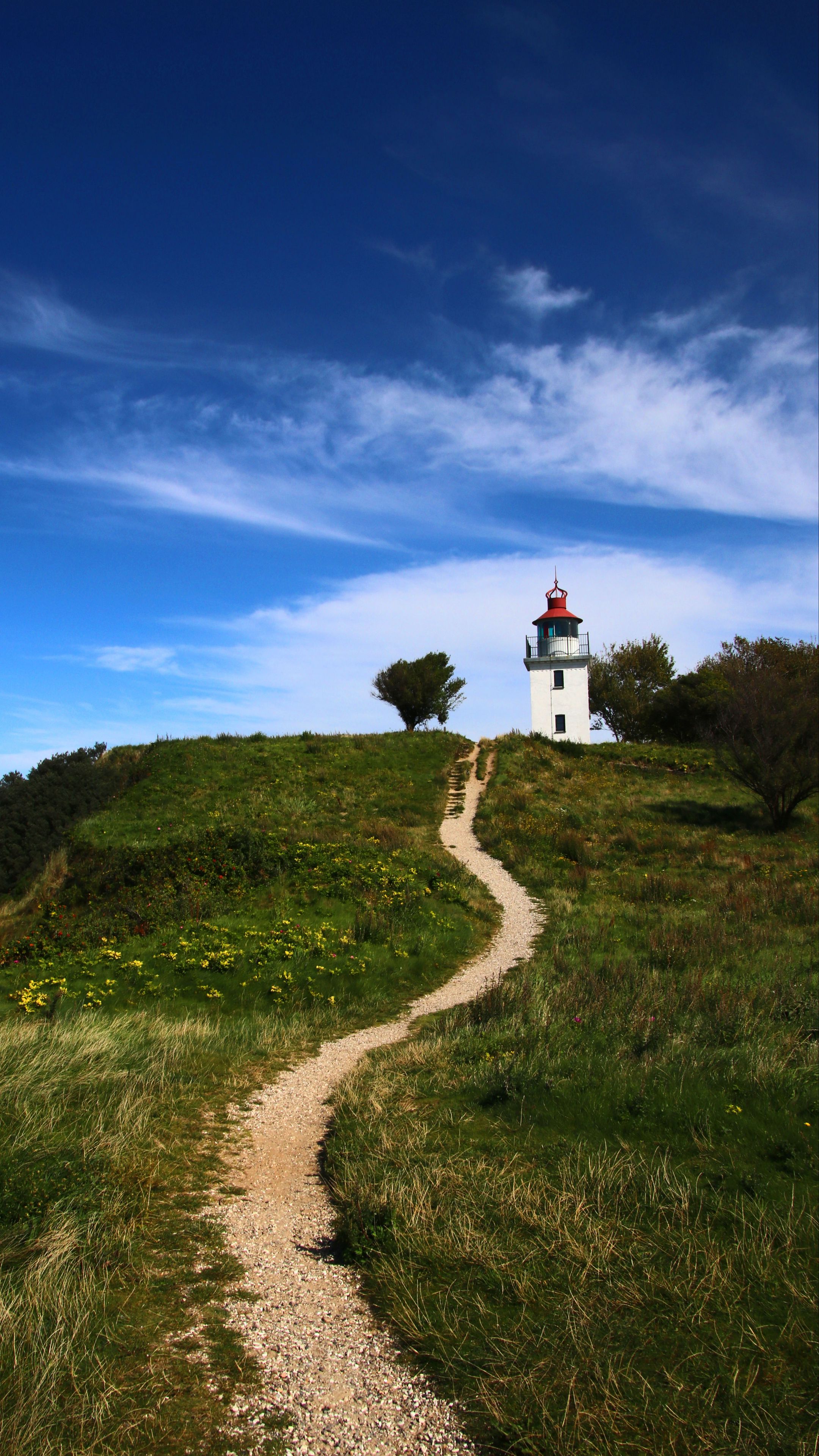 Download wallpaper 2160x3840 trail, lighthouse, hill, grass, nature ...