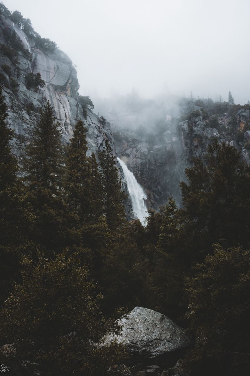 Download wallpaper 800x1200 waterfall, rocks, trees, fog, landscape ...